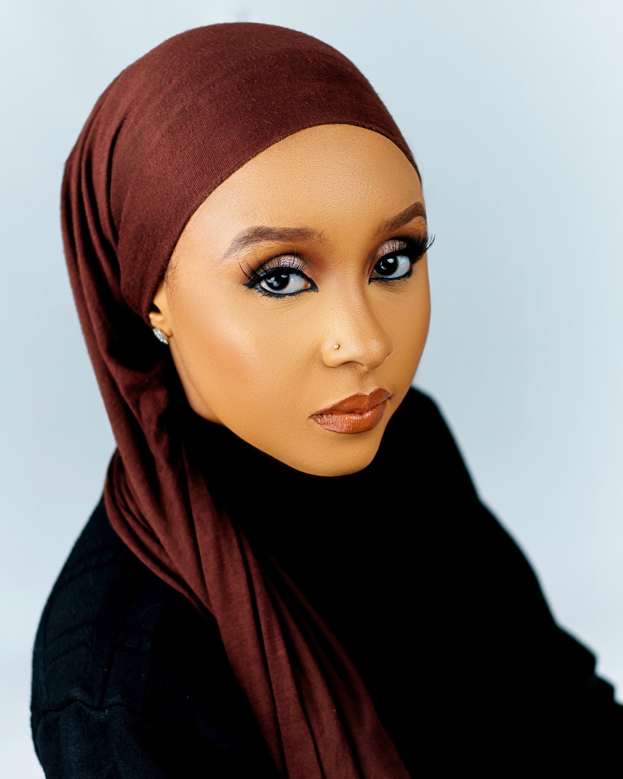 Elegant Portrait of Woman in Maroon Hijab · Free Stock Photo