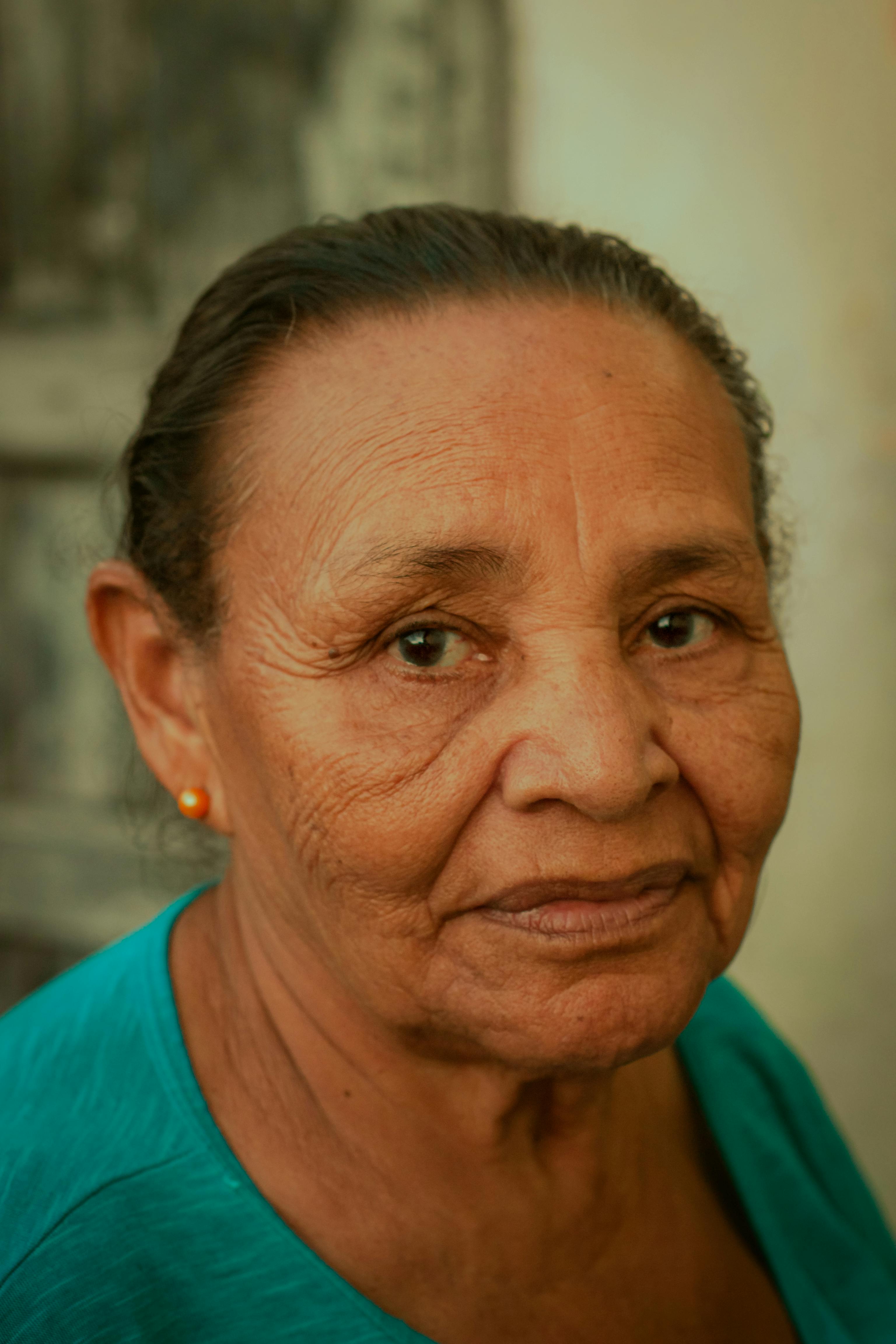 Portrait of Senior Woman with Warm Expression · Free Stock Photo