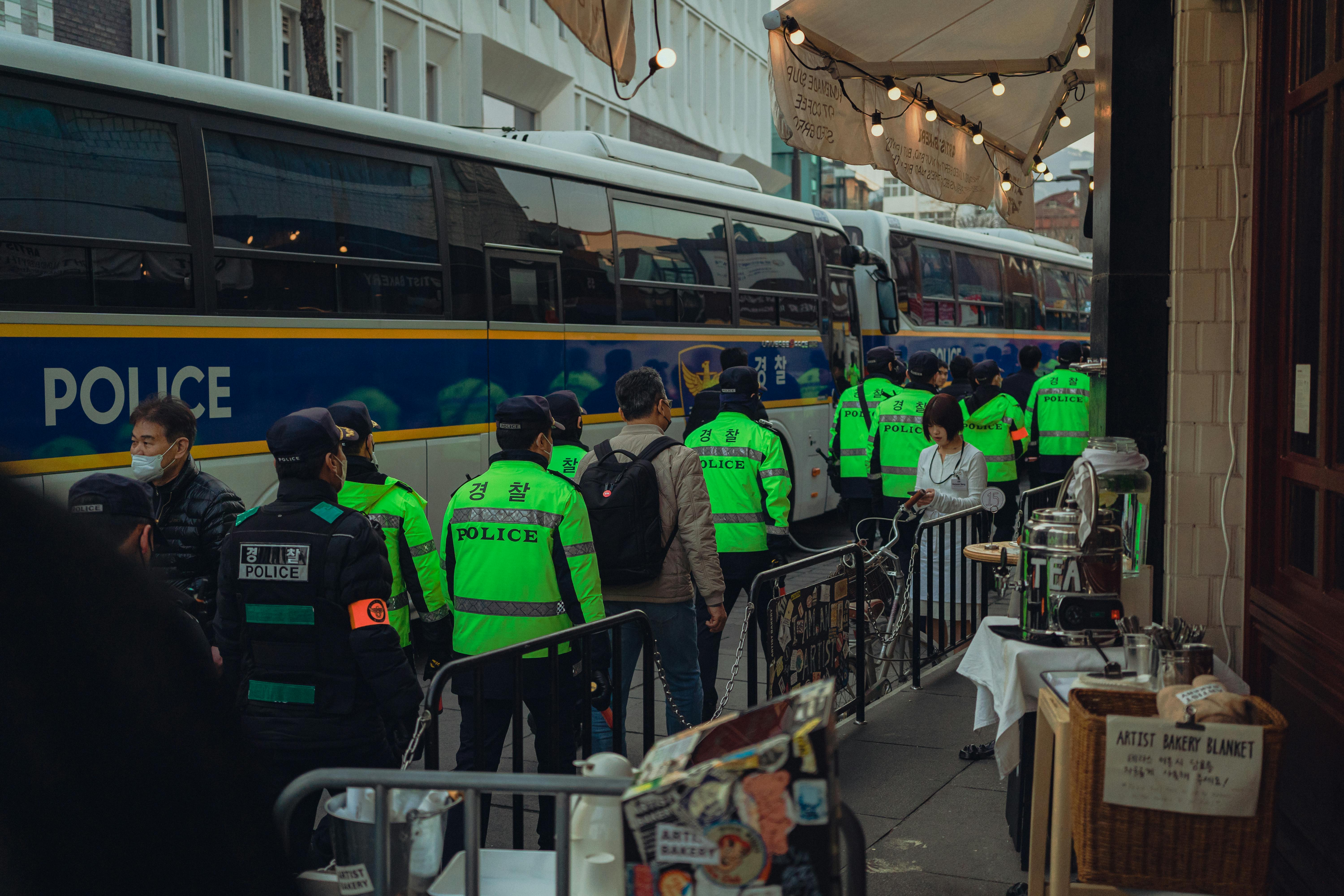 Police presence on Seoul street in fall · Free Stock Photo