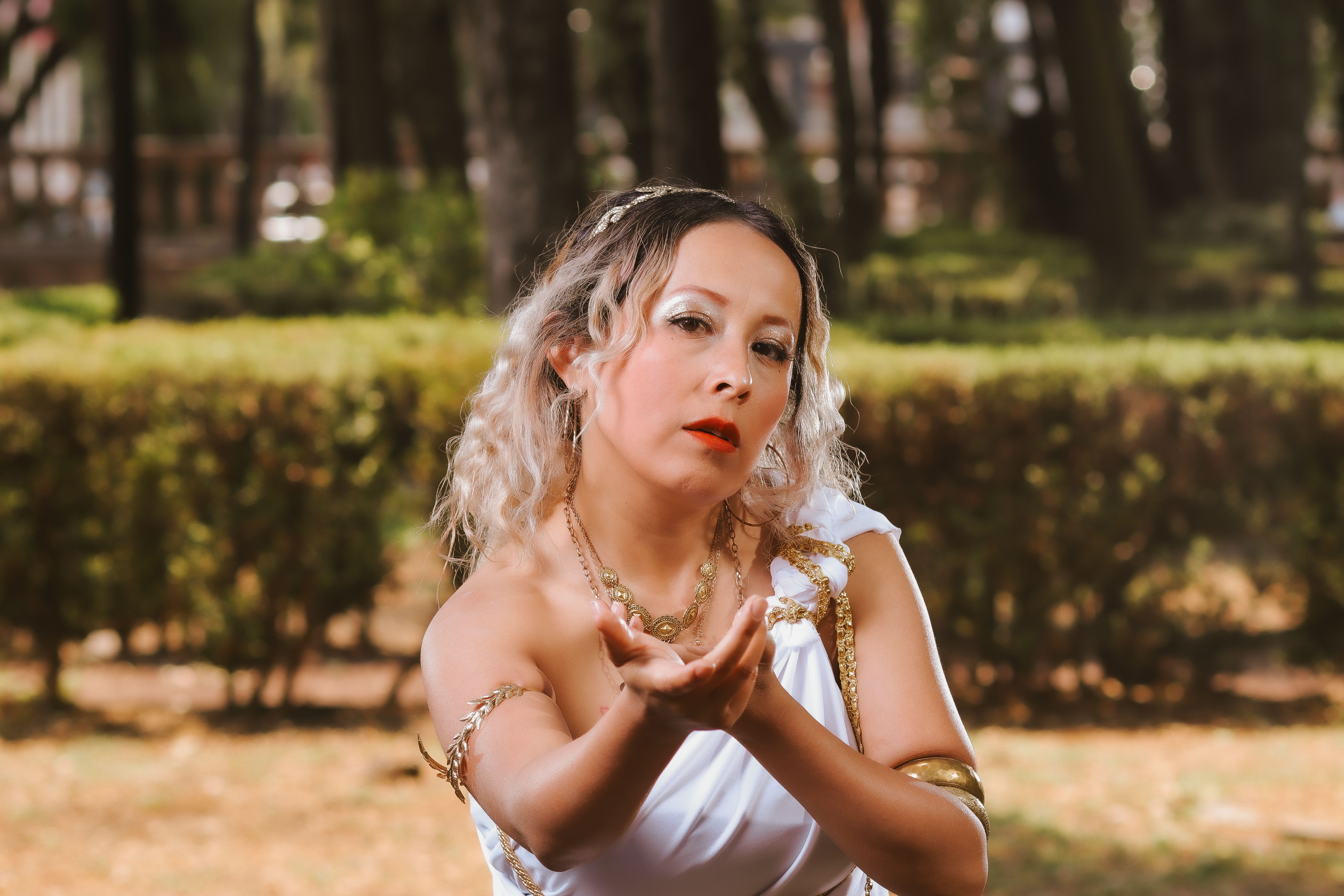 Elegant Woman in Mythological Greek-Inspired Pose · Free Stock Photo