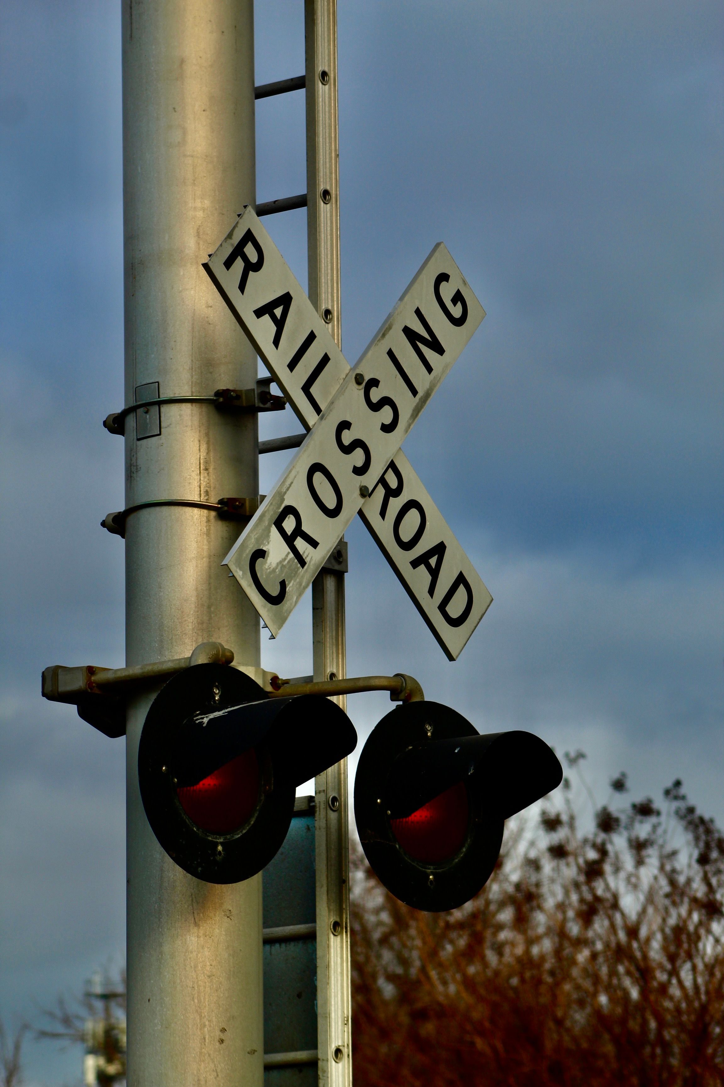 Railroad Crossing Sign with Red Lights · Free Stock Photo