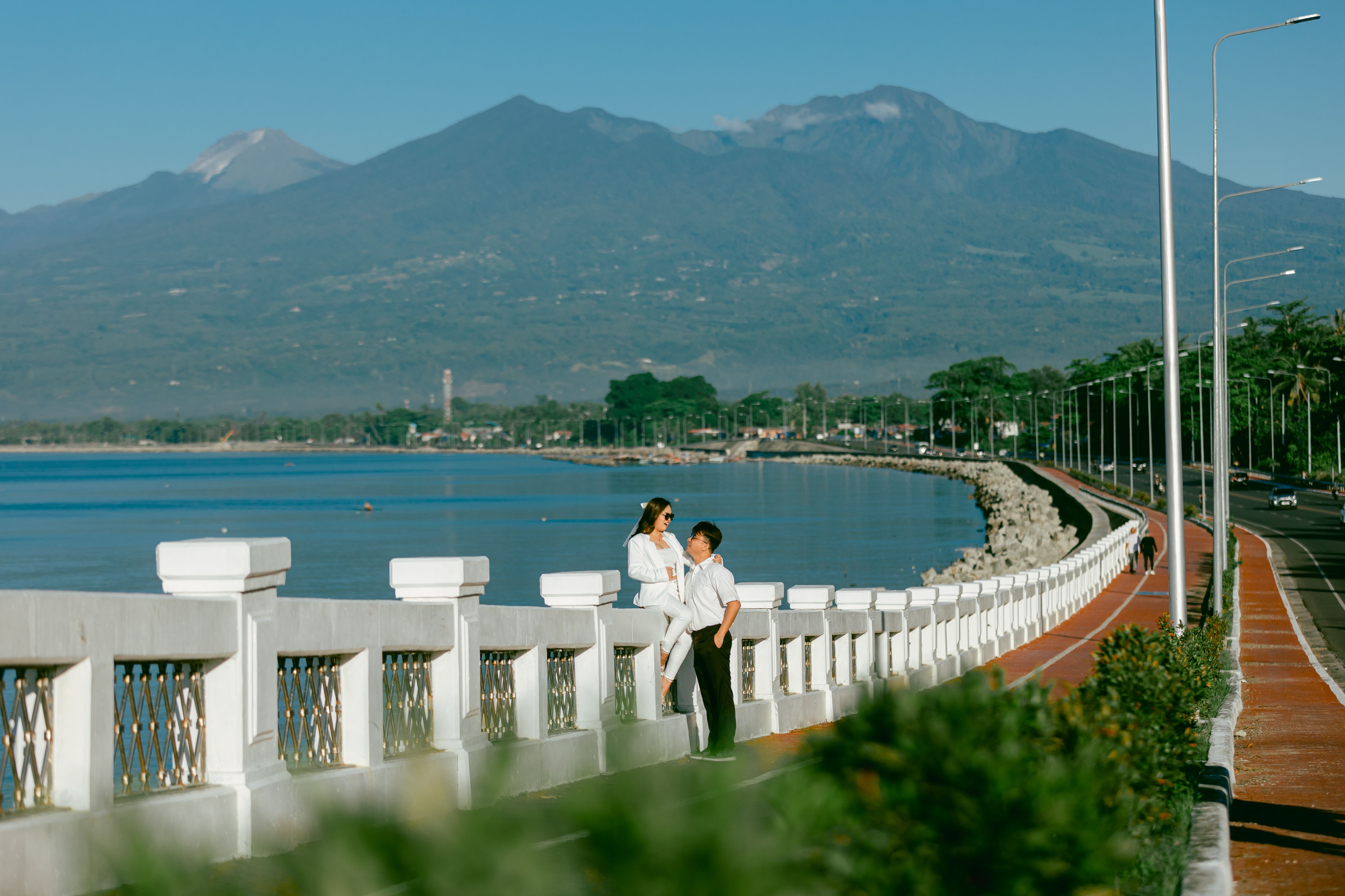 Scenic Seaside Promenade with Mountain View · Free Stock Photo