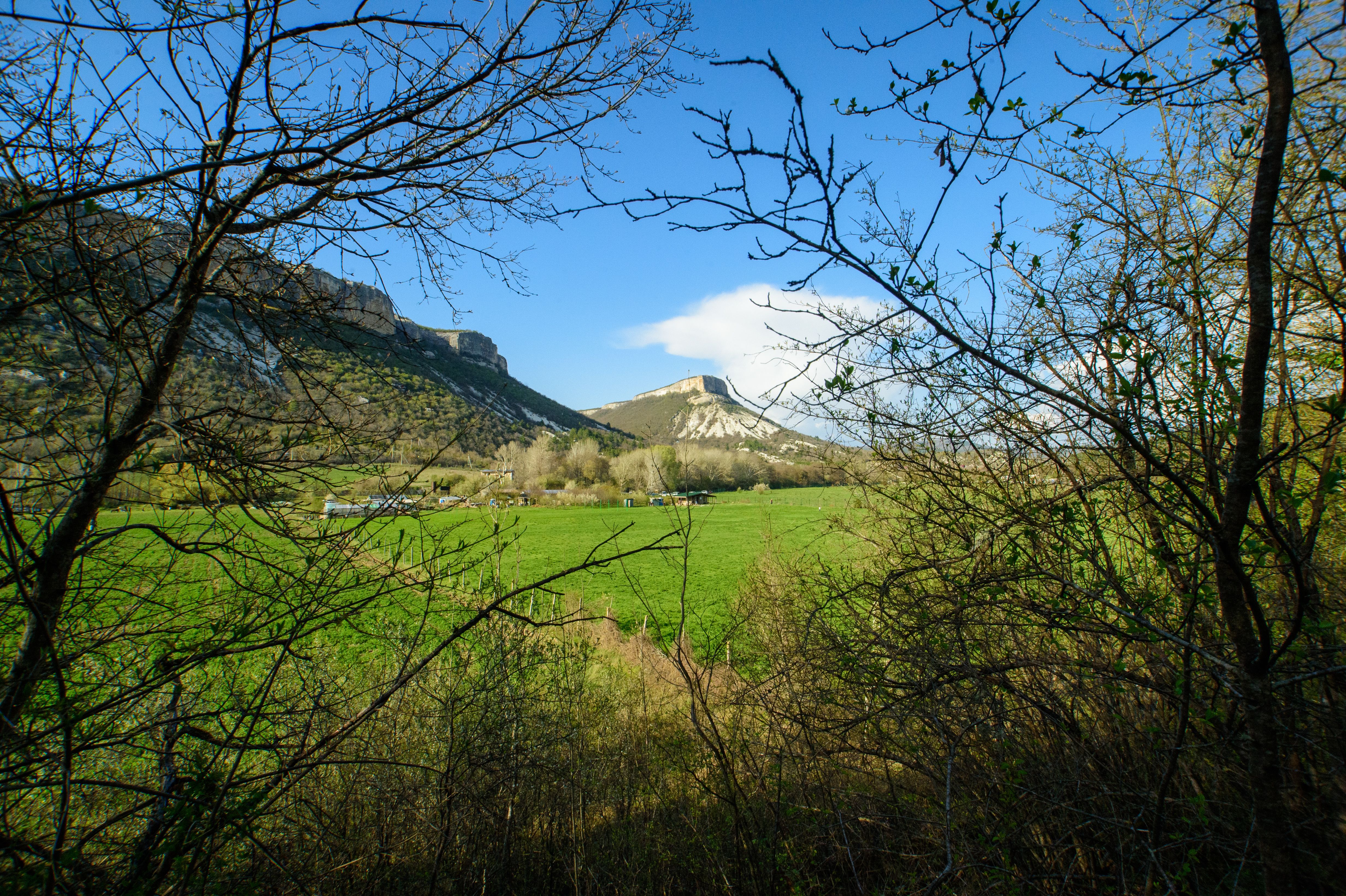 Scenic Landscape View With Green Fields and Mountains · Free Stock Photo