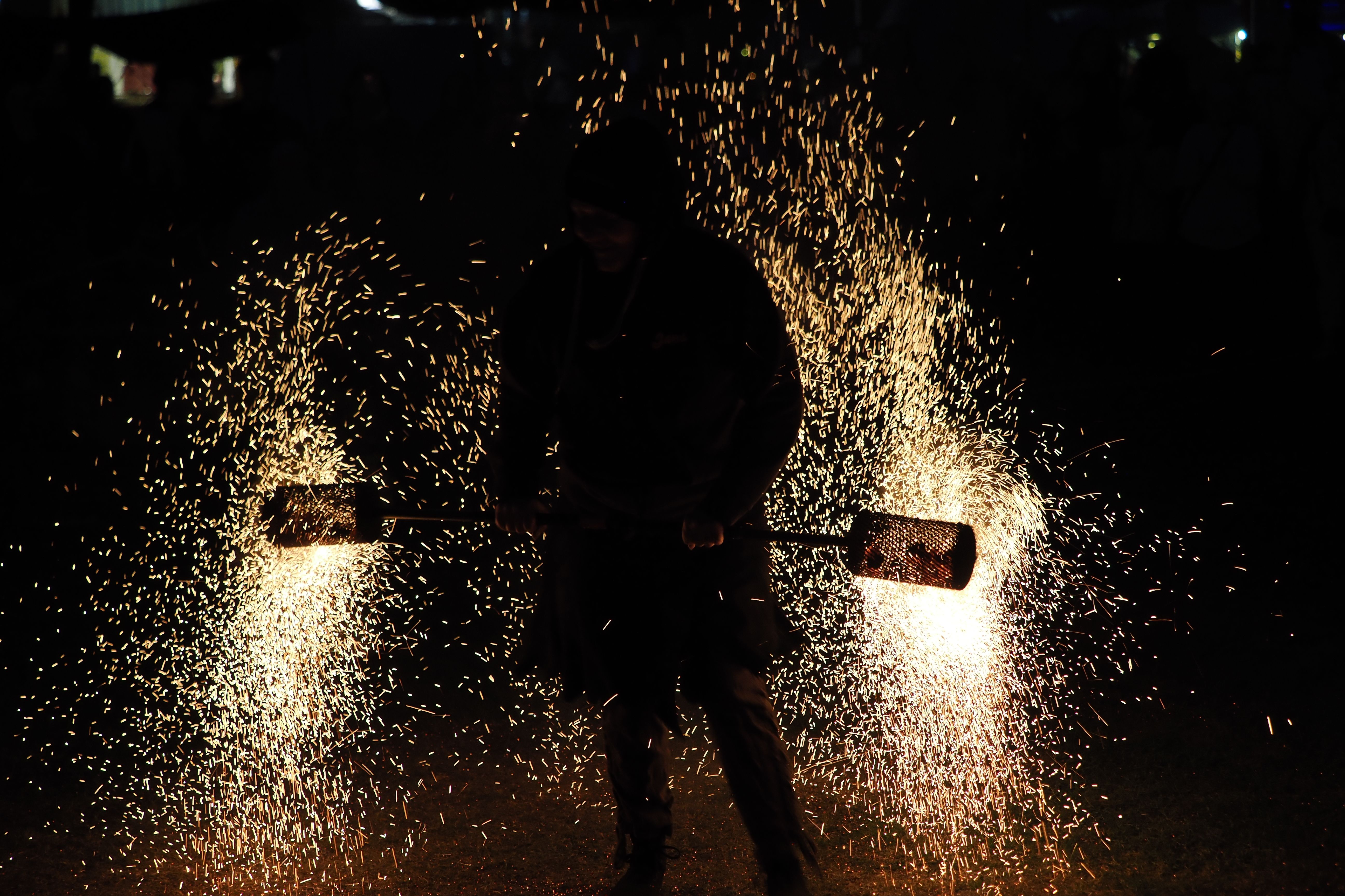 Fire Performer Displaying Captivating Sparks · Free Stock Photo