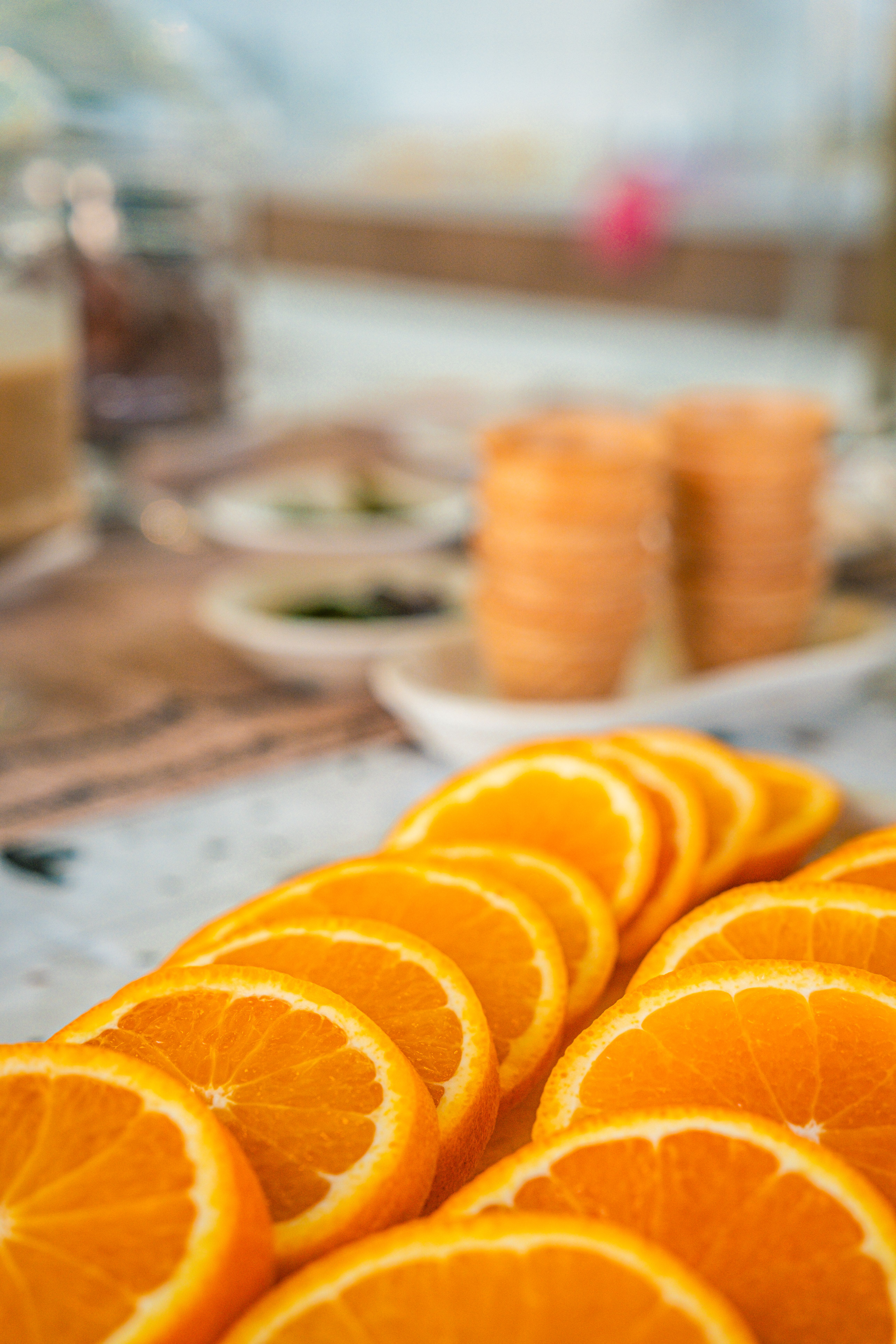 Vibrant Sliced Oranges on Breakfast Table · Free Stock Photo