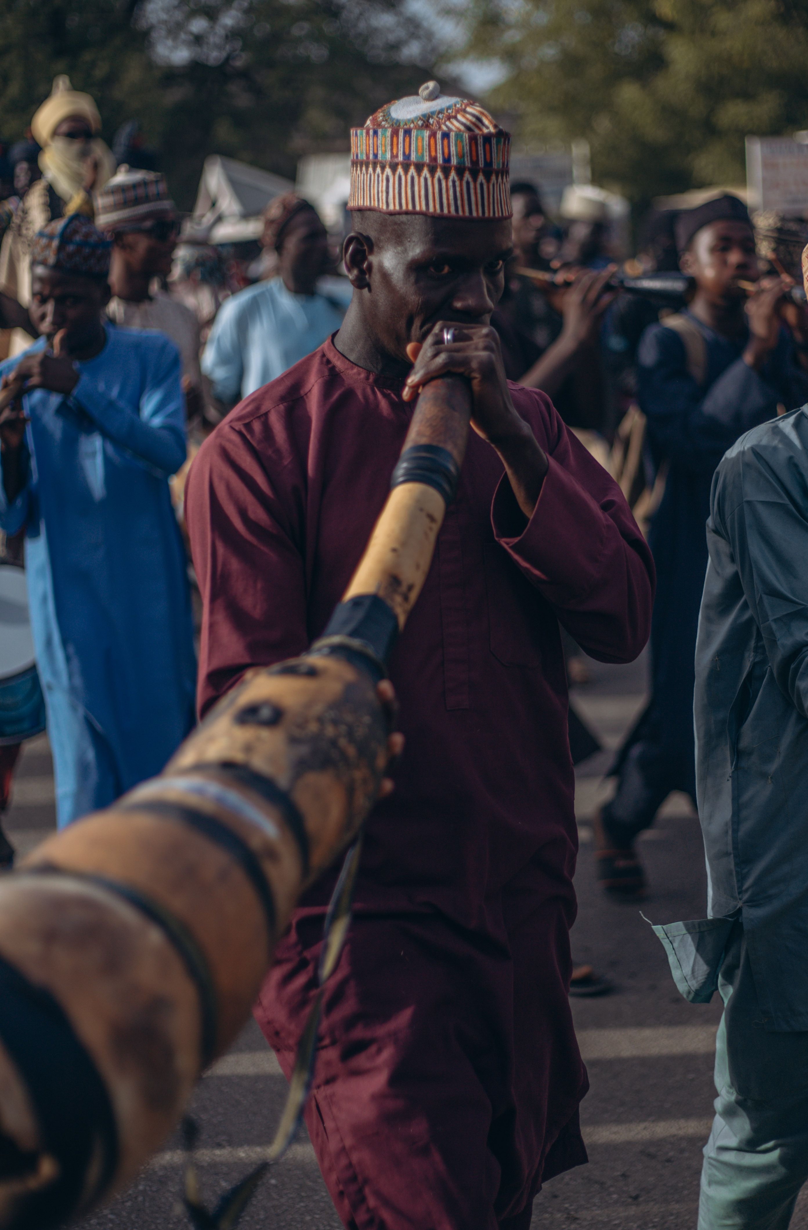 Traditional African Music Parade with Horn Player · Free Stock Photo