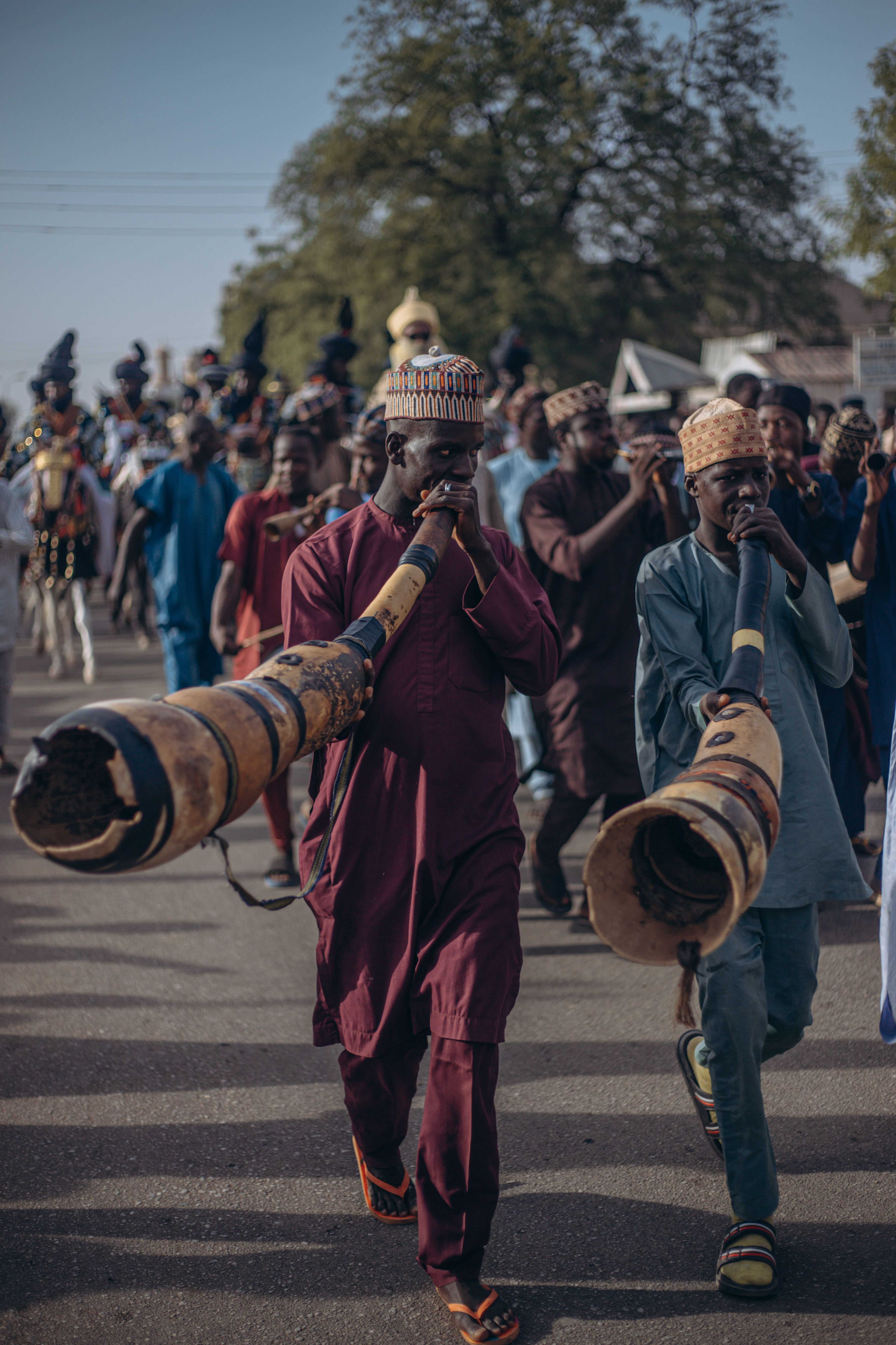 Traditional Music Procession with Large Horns · Free Stock Photo