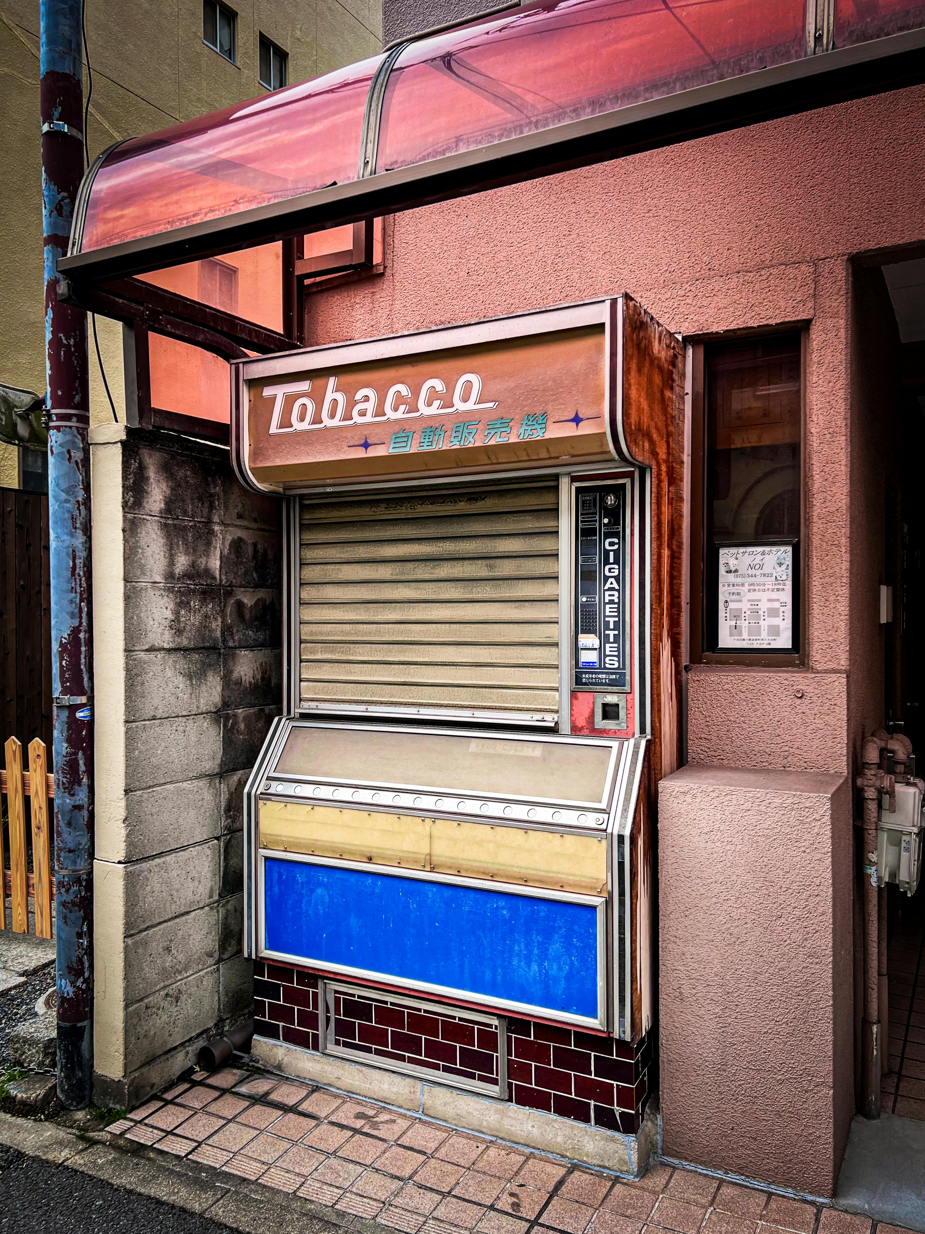 Vintage Tobacco Vending Machine in Urban Setting · Free Stock Photo