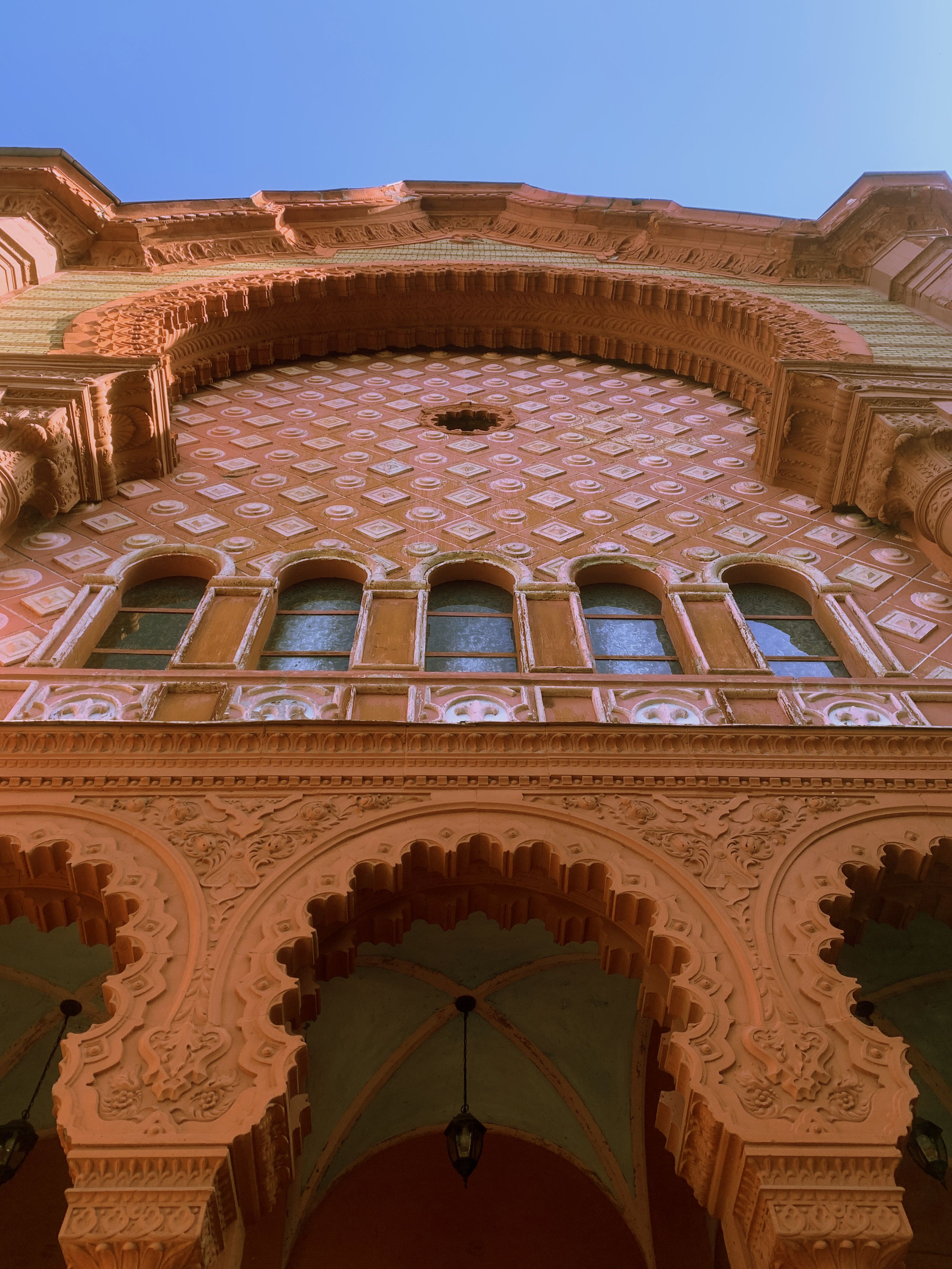 Ornate Architectural Facade with Arches and Patterns · Free Stock Photo