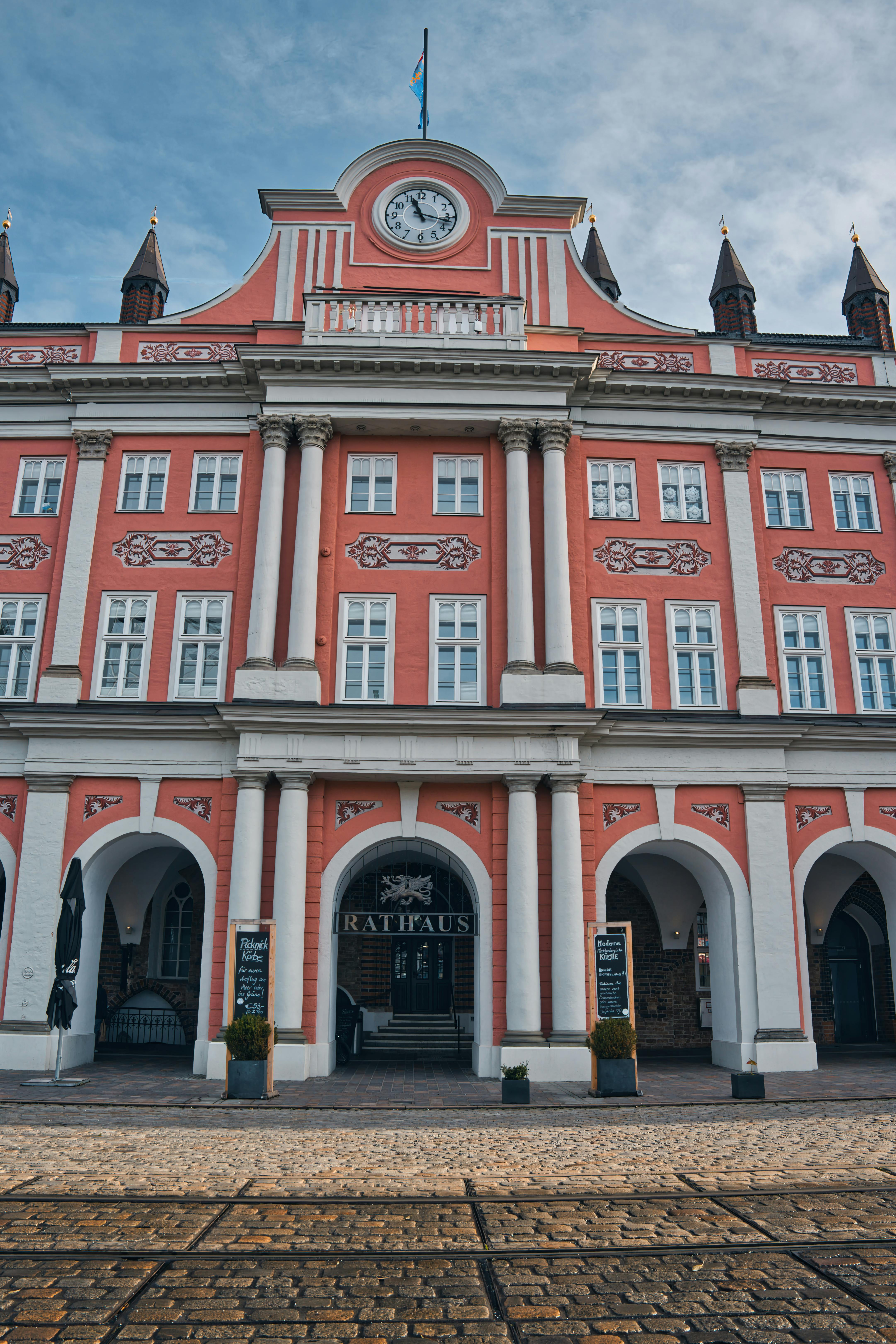 Historic Pink Town Hall Building in Rostock · Free Stock Photo