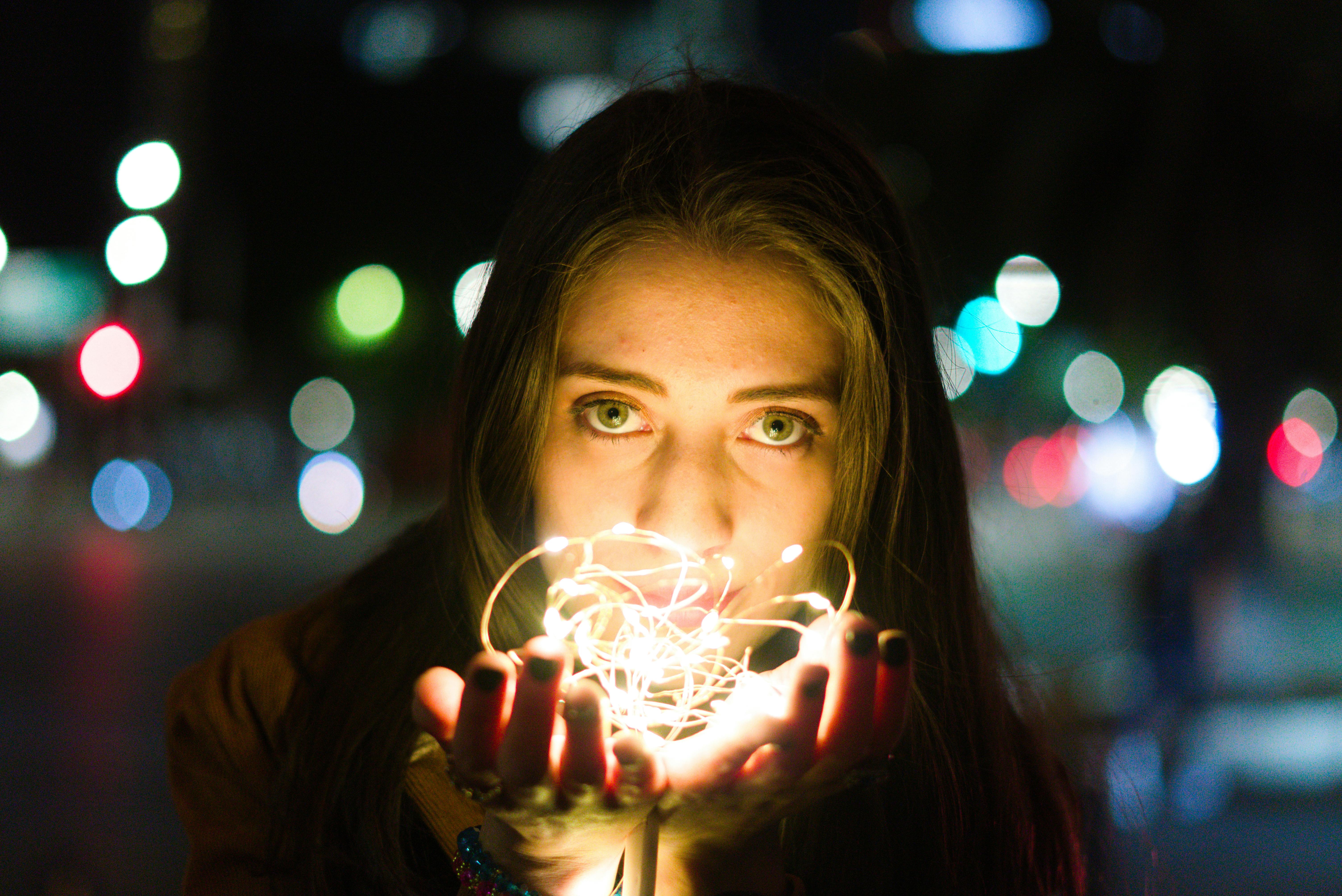 Woman Holding Fireflies · Free Stock Photo