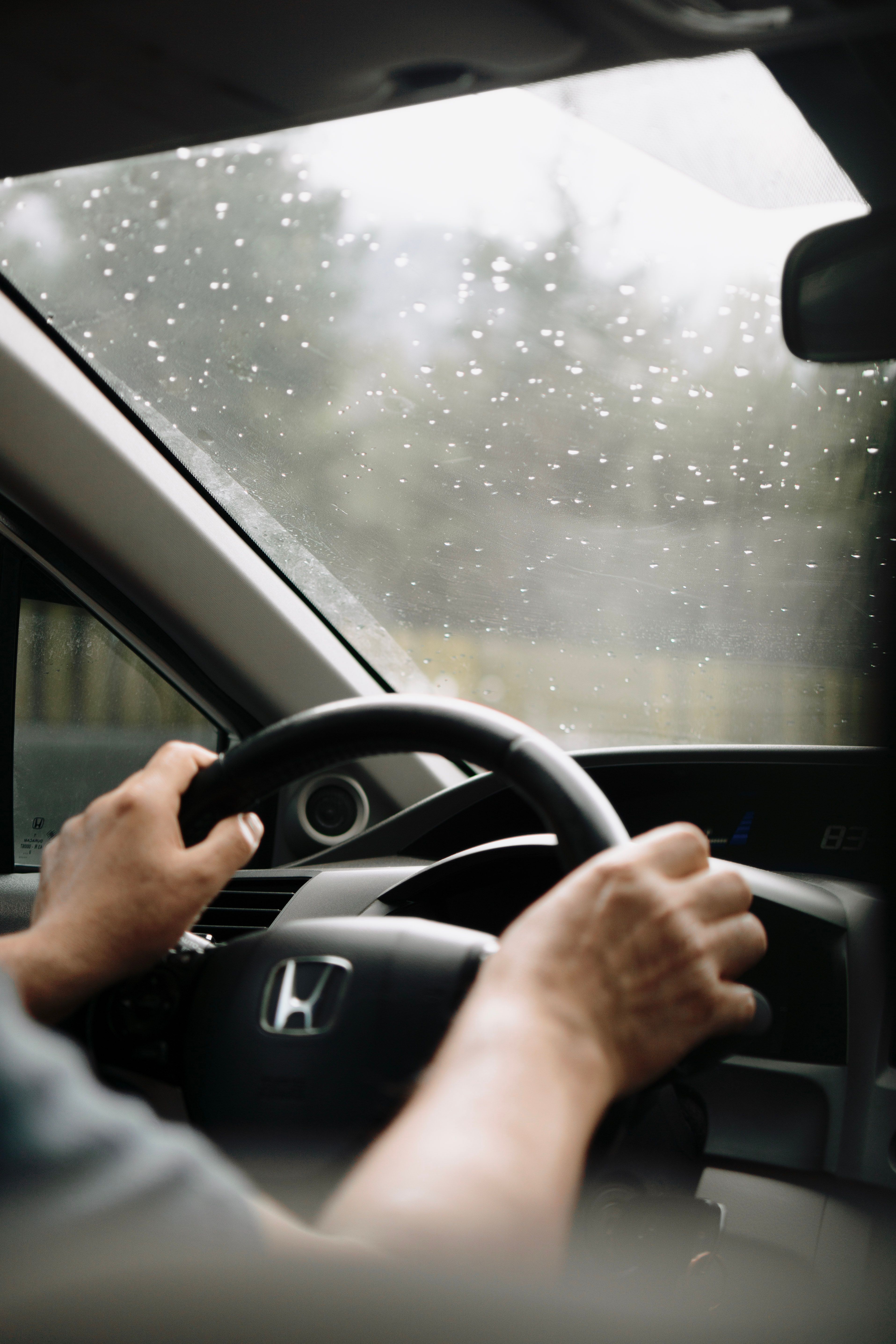 Driving in Rainy Weather Through Car's Windshield · Free Stock Photo
