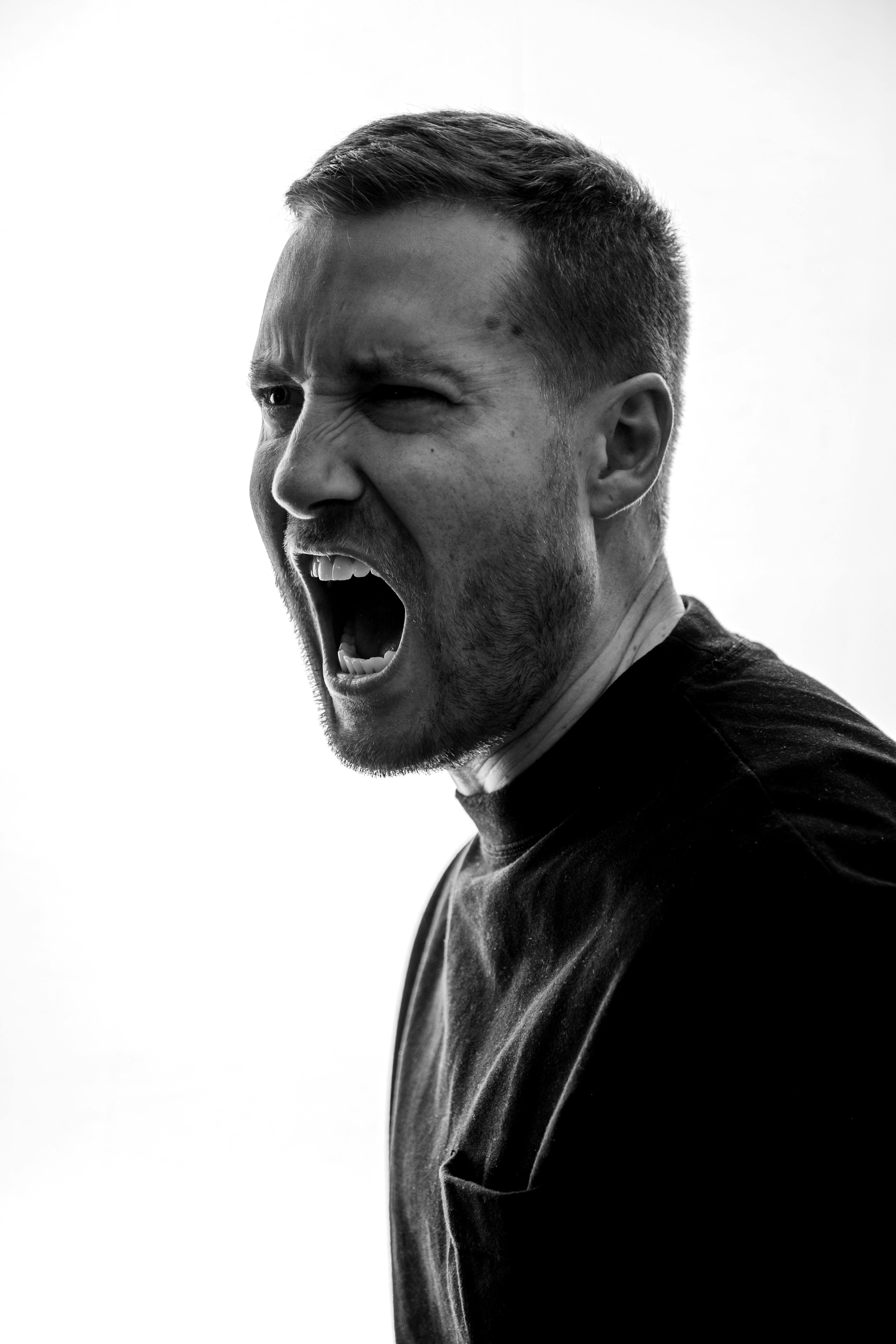 Expressive Portrait of Man Shouting in Anger · Free Stock Photo
