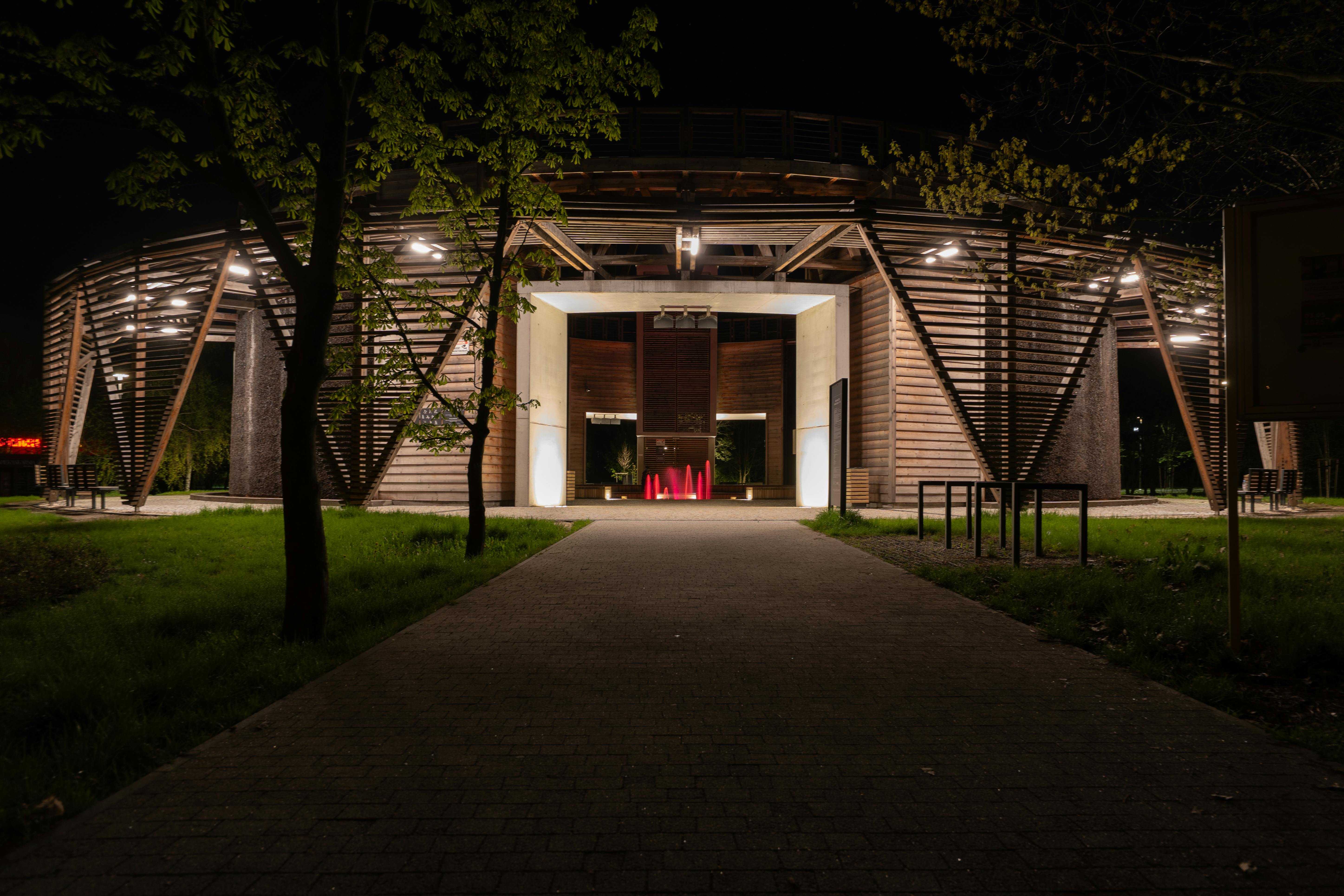 Modern Wooden Structure Illuminated at Night in Poland · Free Stock Photo