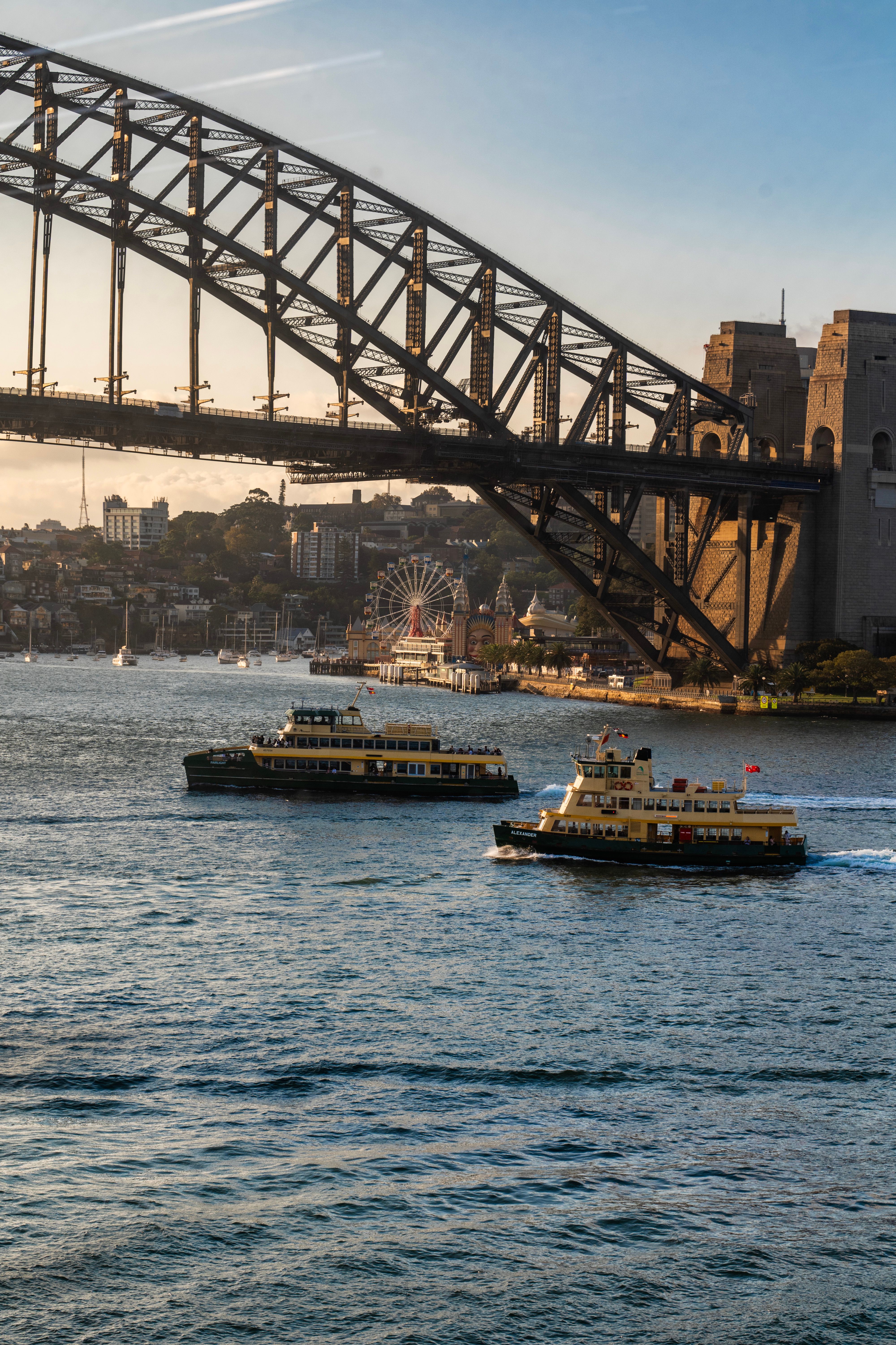 Sydney Harbour Bridge with Ferries at Sunset · Free Stock Photo
