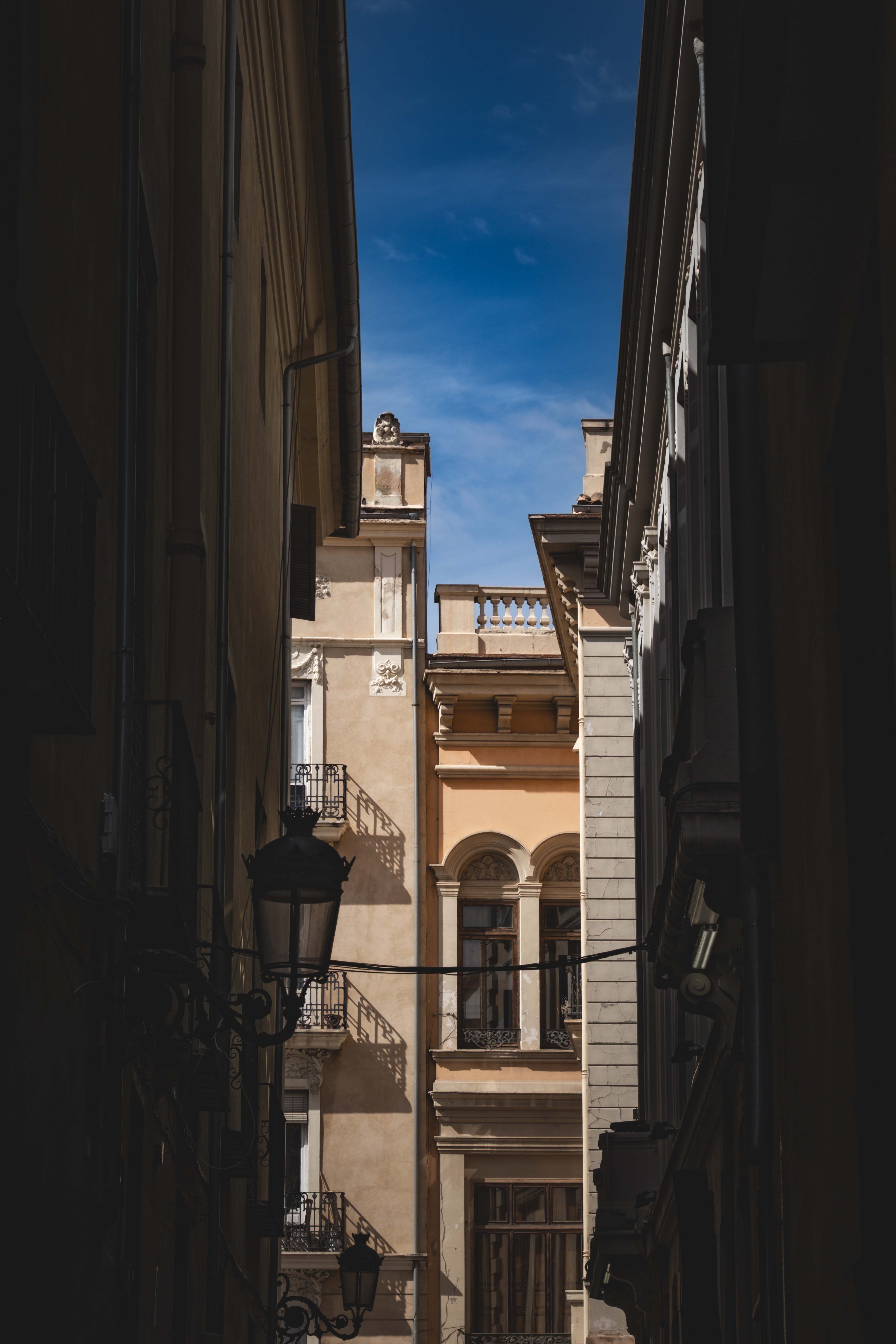 Elegant European Architecture Framed by Shadows · Free Stock Photo