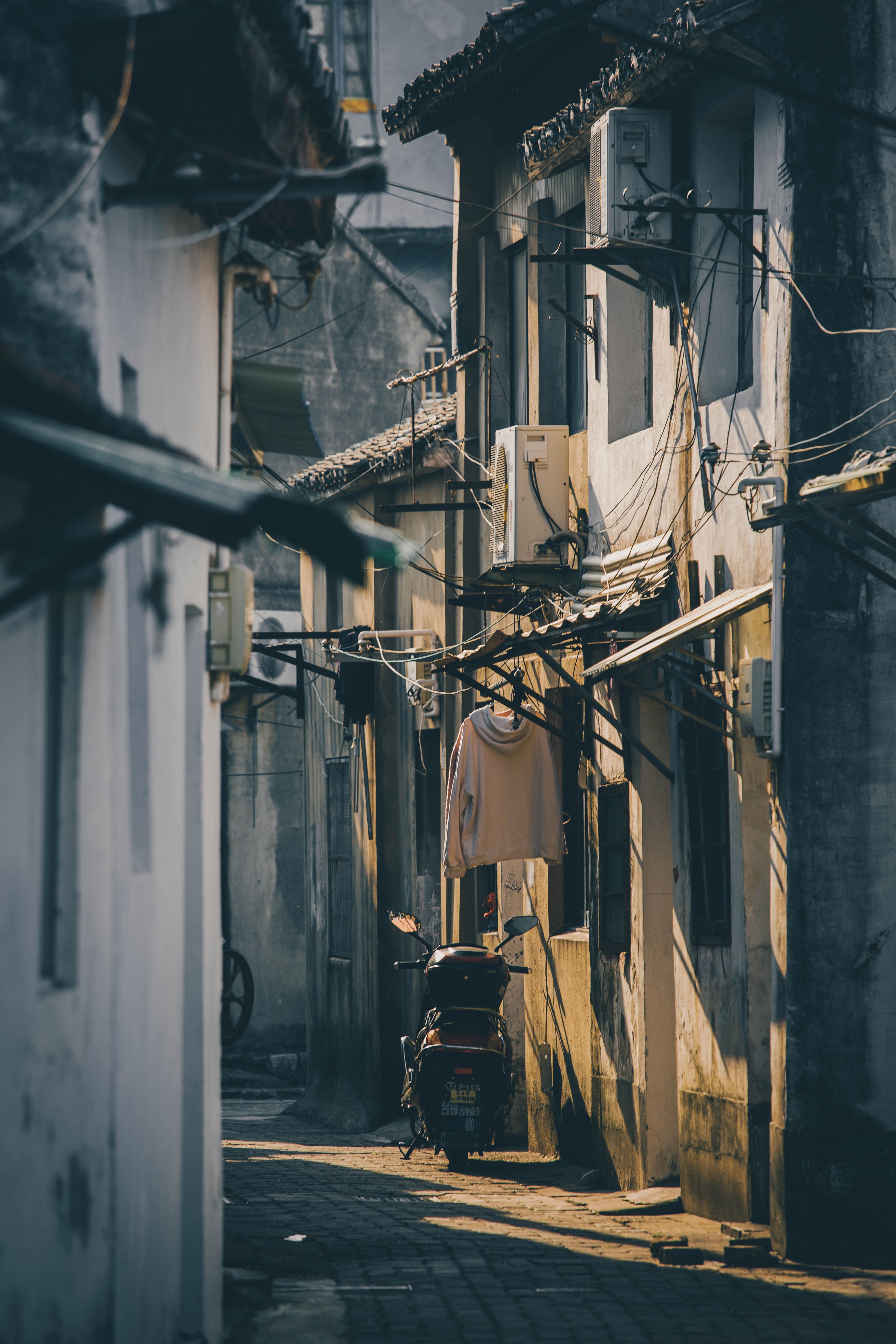 Narrow Urban Alleyway with Shadows and Light · Free Stock Photo