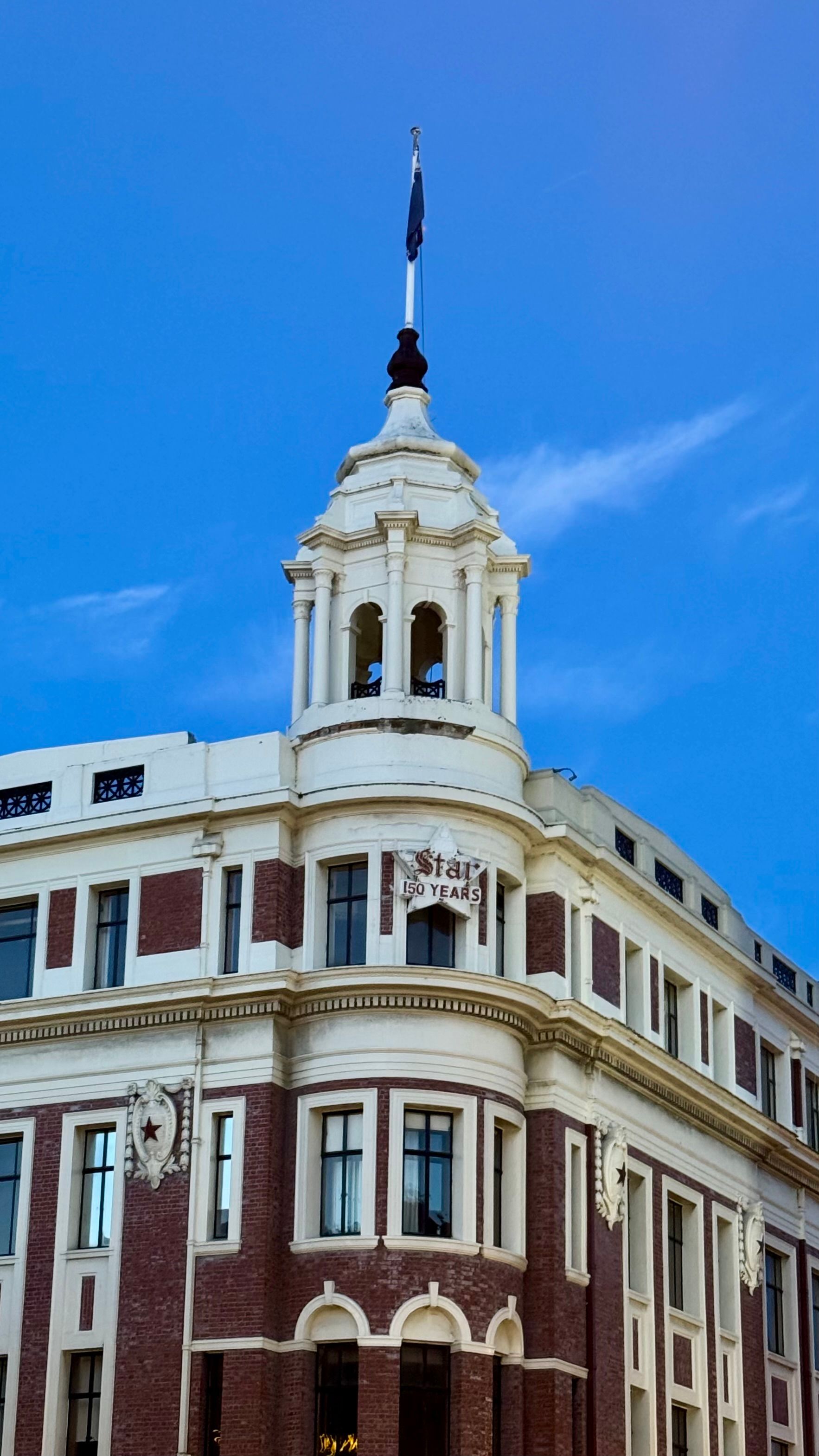 Historic Dunedin Building Against Clear Sky · Free Stock Photo