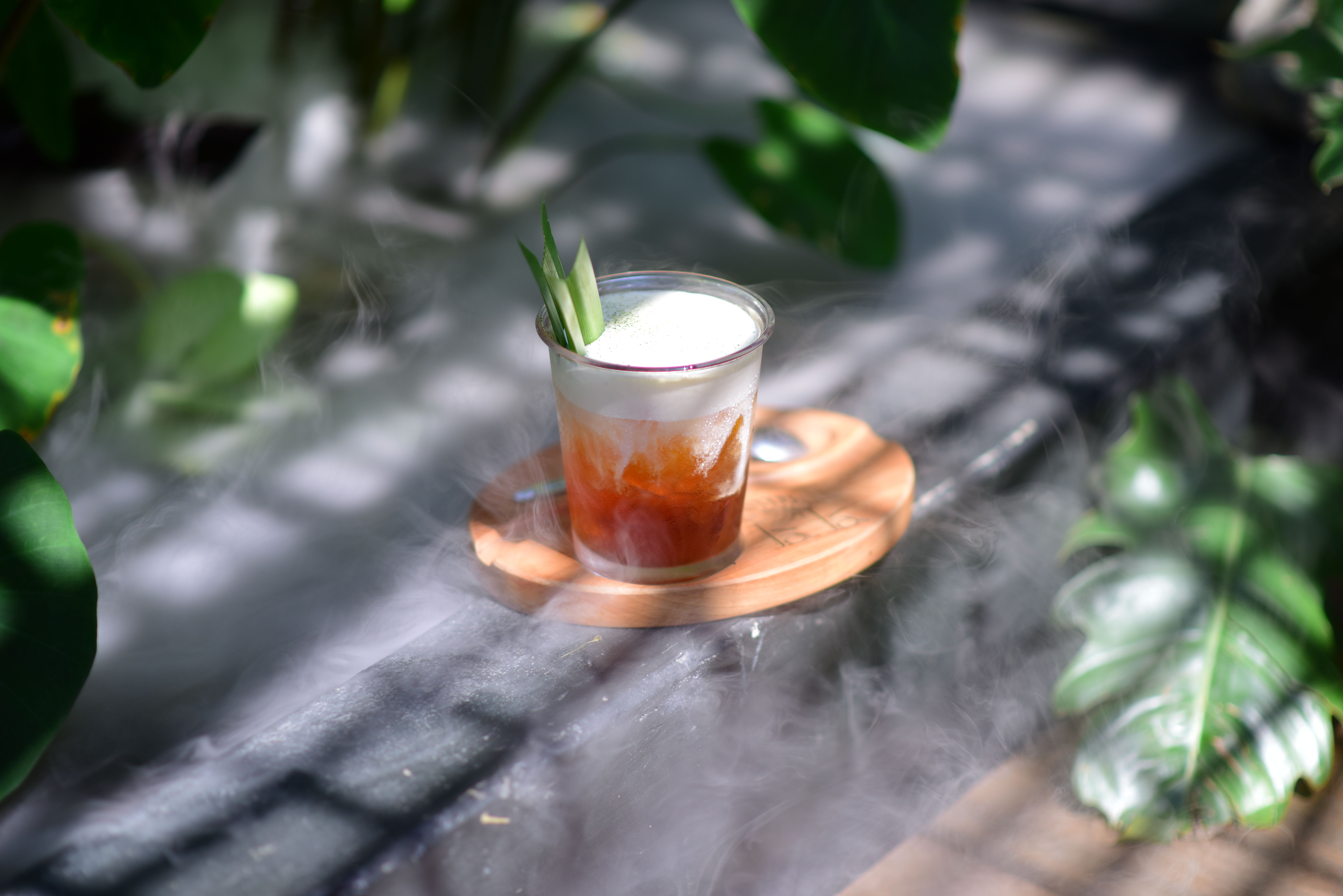 Refreshing Tropical Iced Tea in Misty Garden Setting · Free Stock Photo