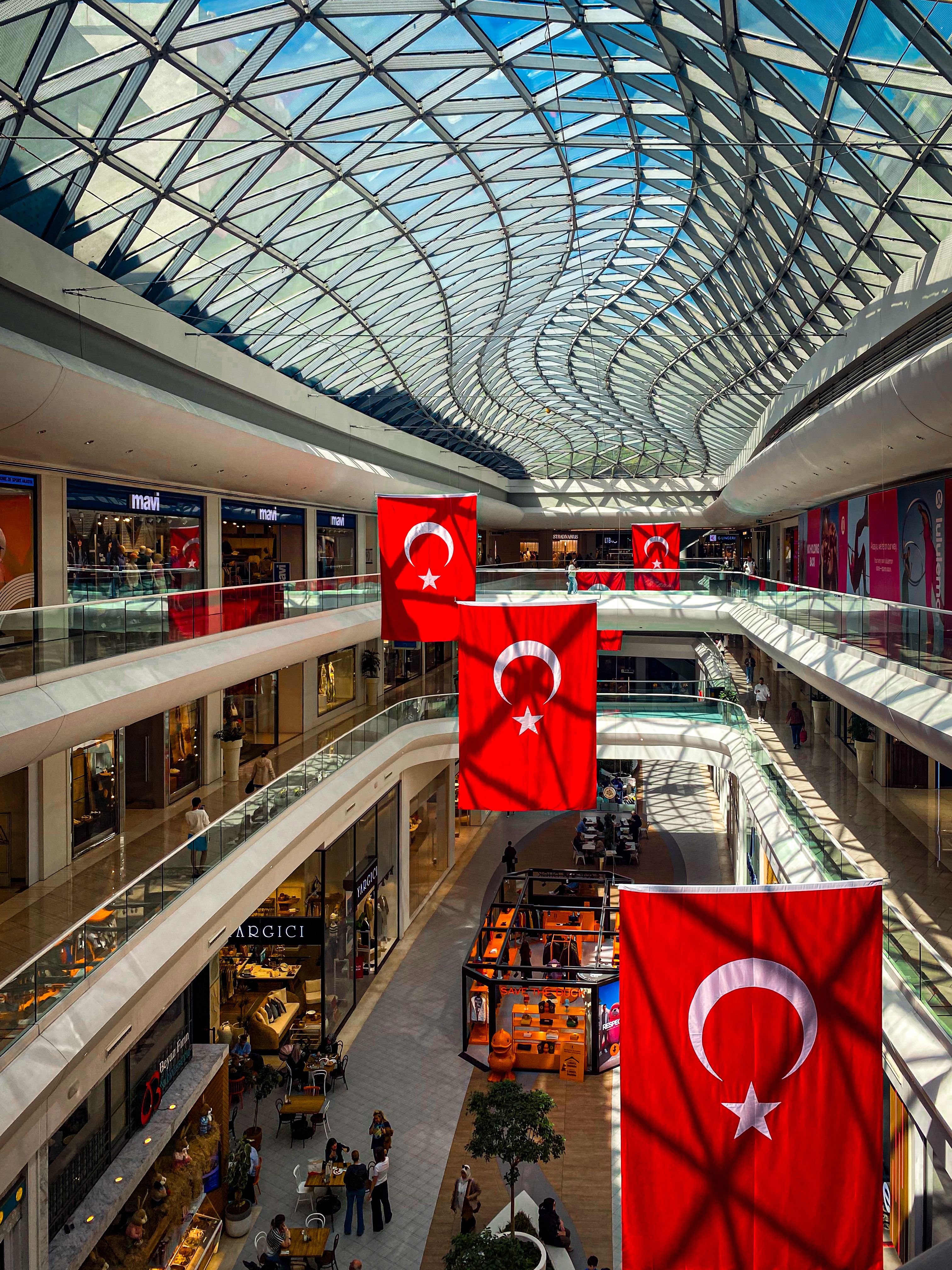 Modern Shopping Mall with Turkish Flags Displayed · Free Stock Photo