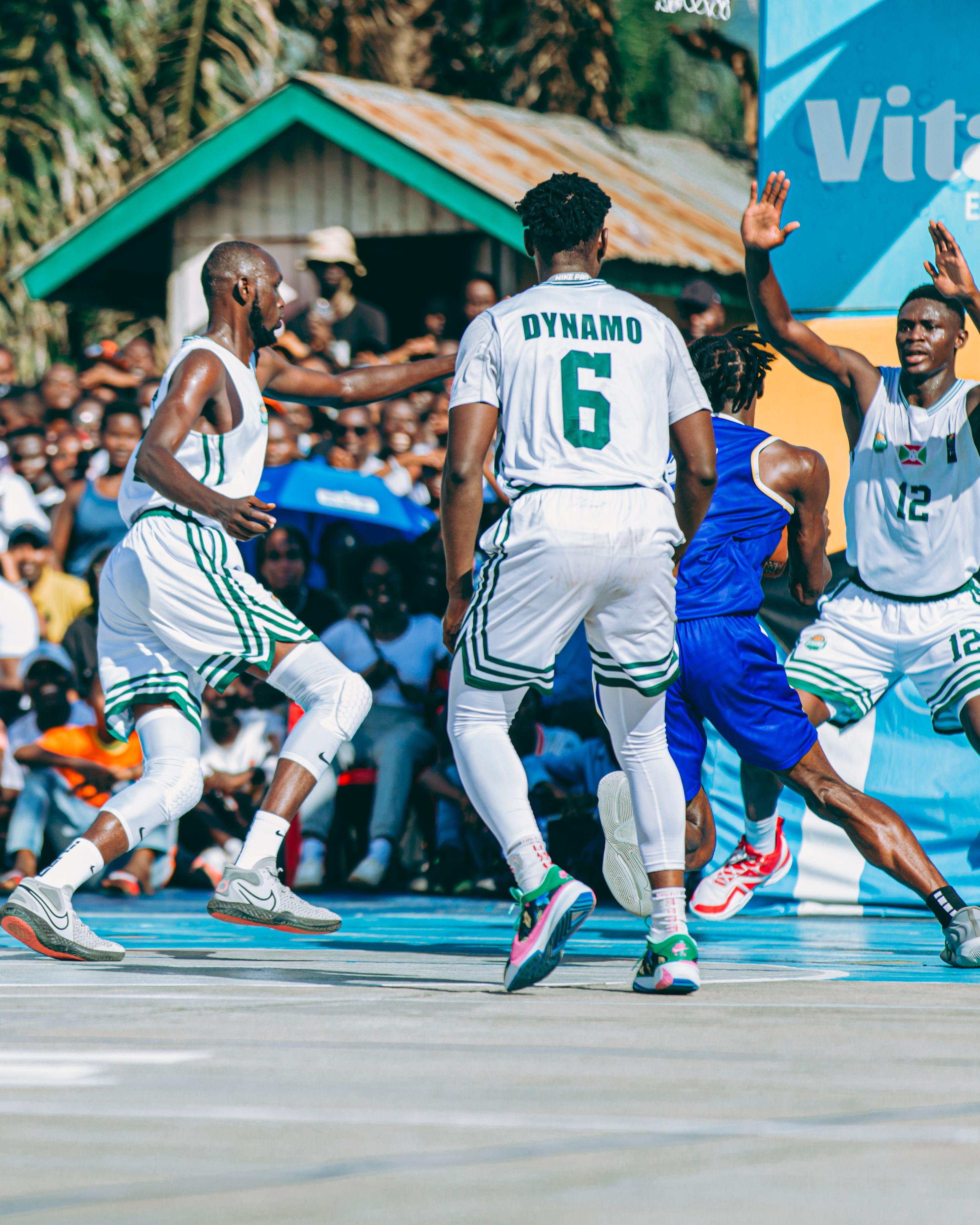 Intense Outdoor Basketball Game with Teams · Free Stock Photo