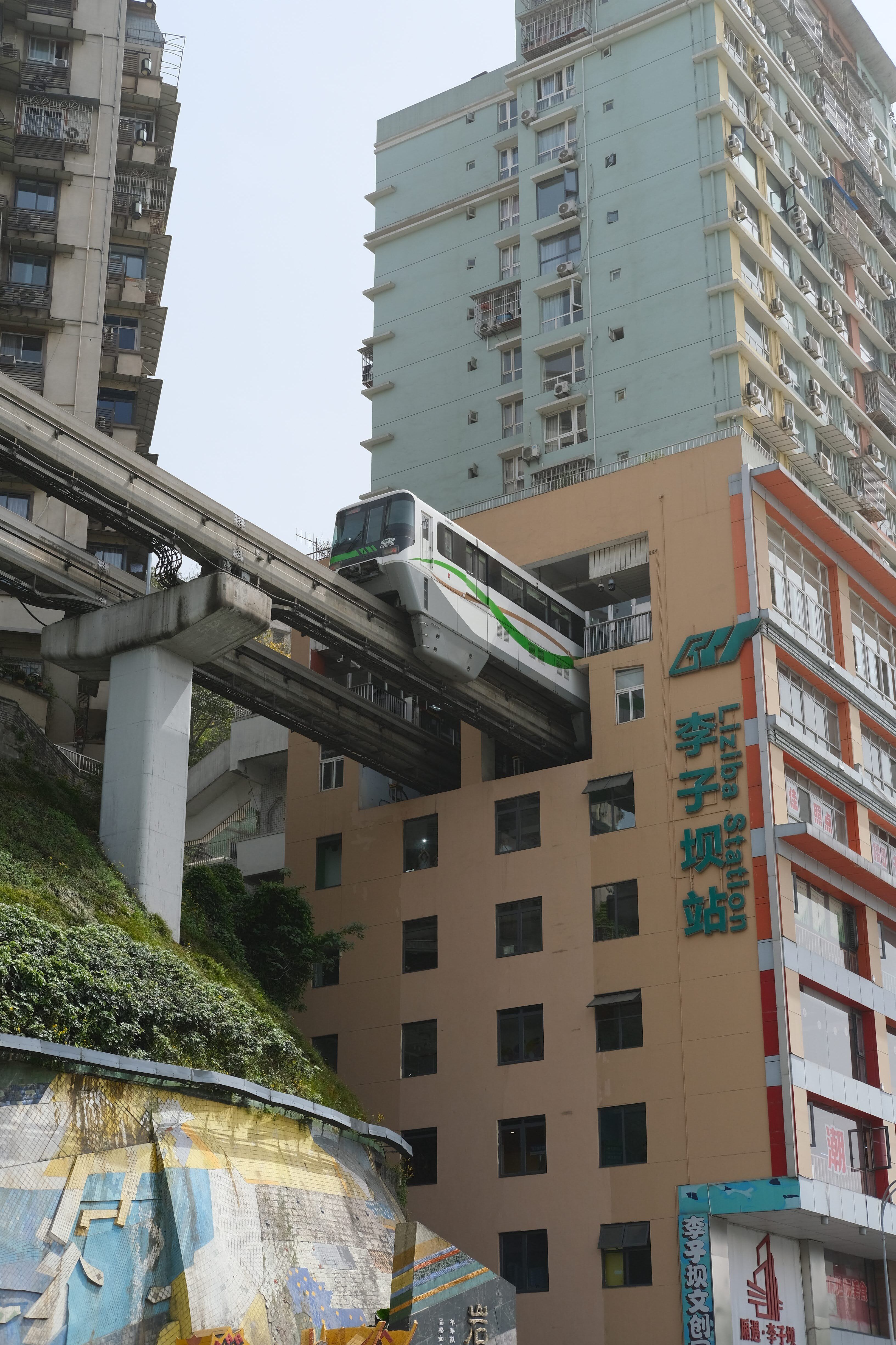 Urban Monorail Passing Through Building in Chongqing · Free Stock Photo