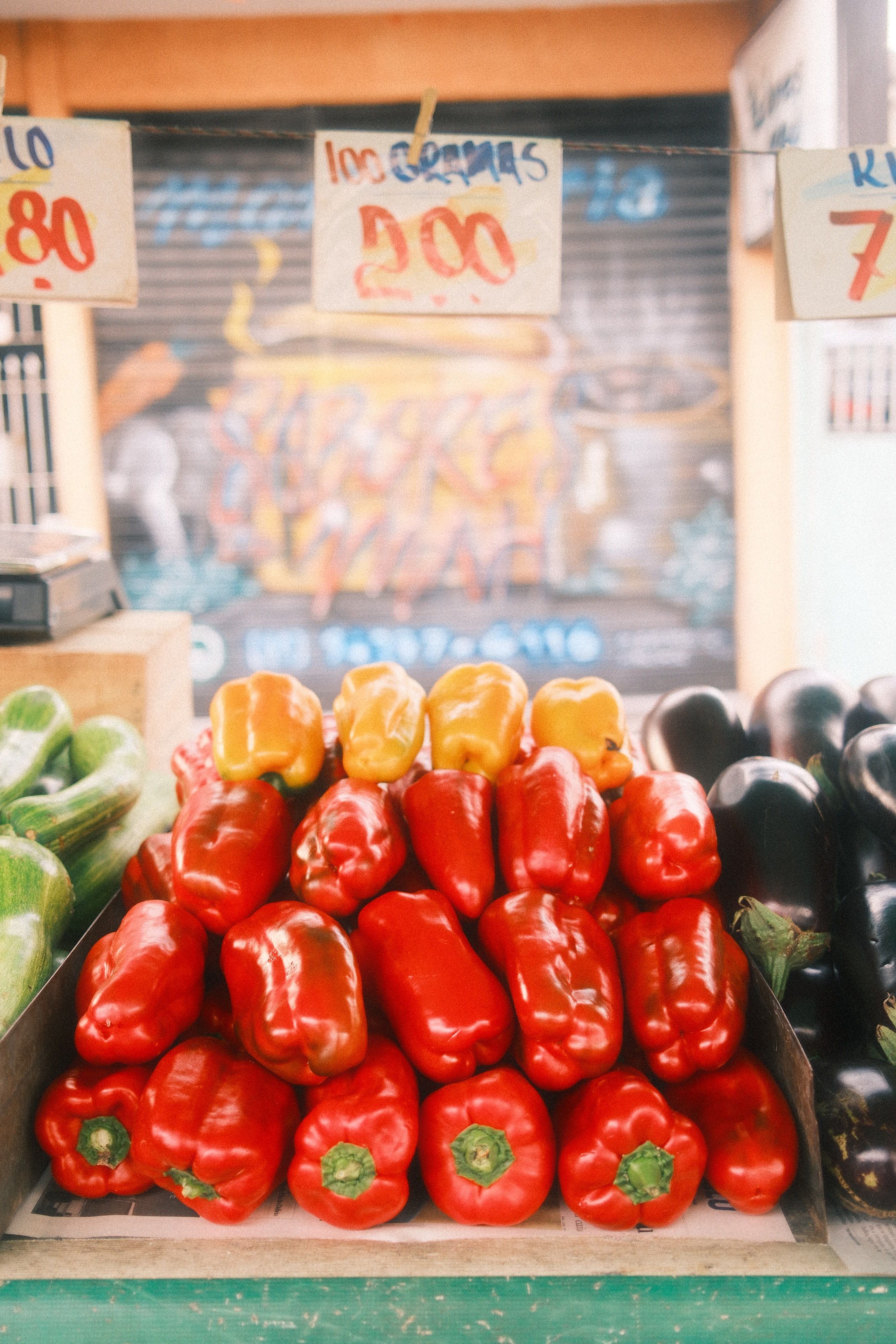 Vibrant Market Stall with Fresh Bell Peppers · Free Stock Photo