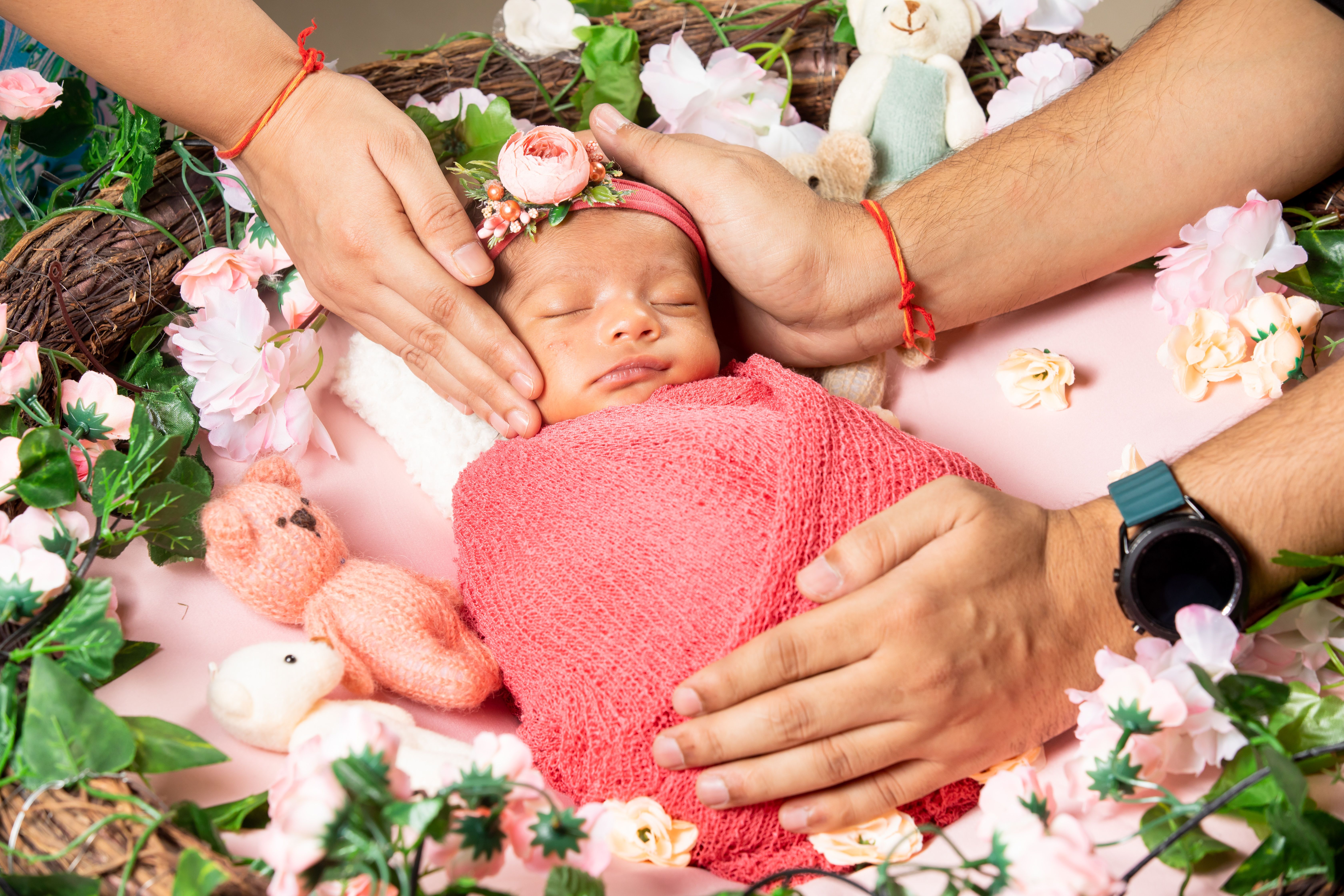 Adorable Newborn Baby Surrounded by Flowers · Free Stock Photo
