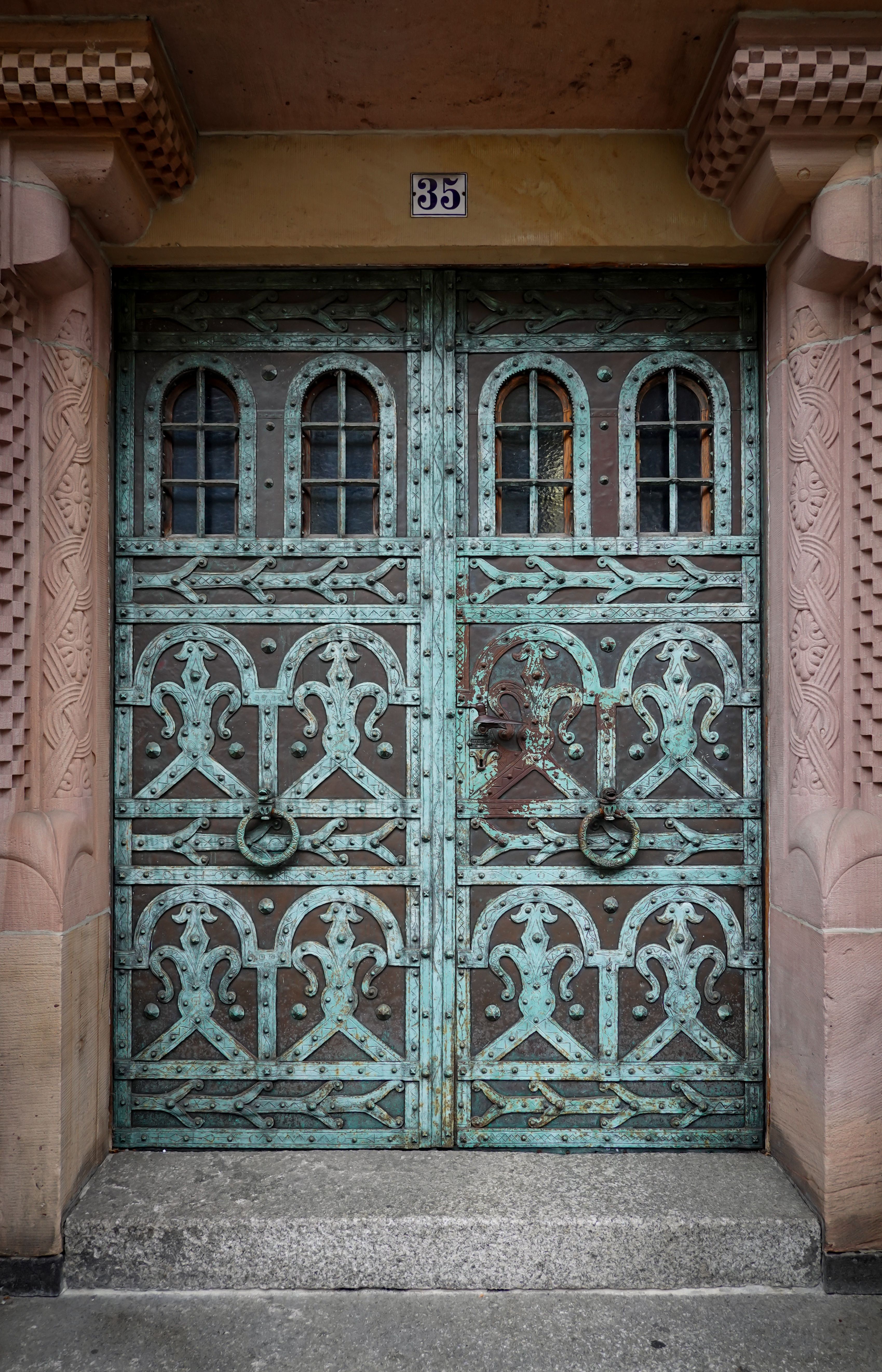 Vintage Ornate Arched Green Metal Doorway · Free Stock Photo