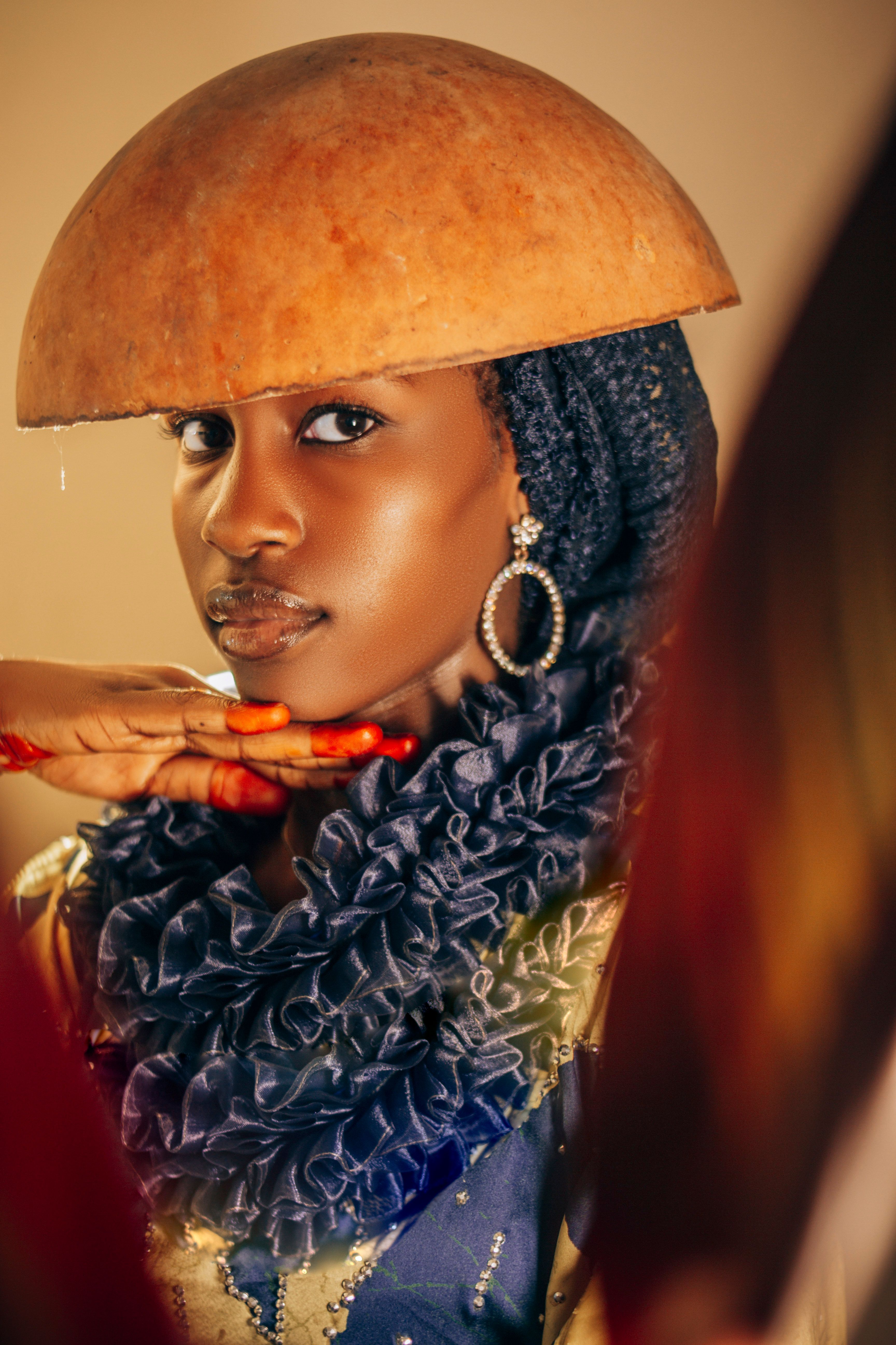 Elegant Portrait of Woman with Unique Headwear · Free Stock Photo