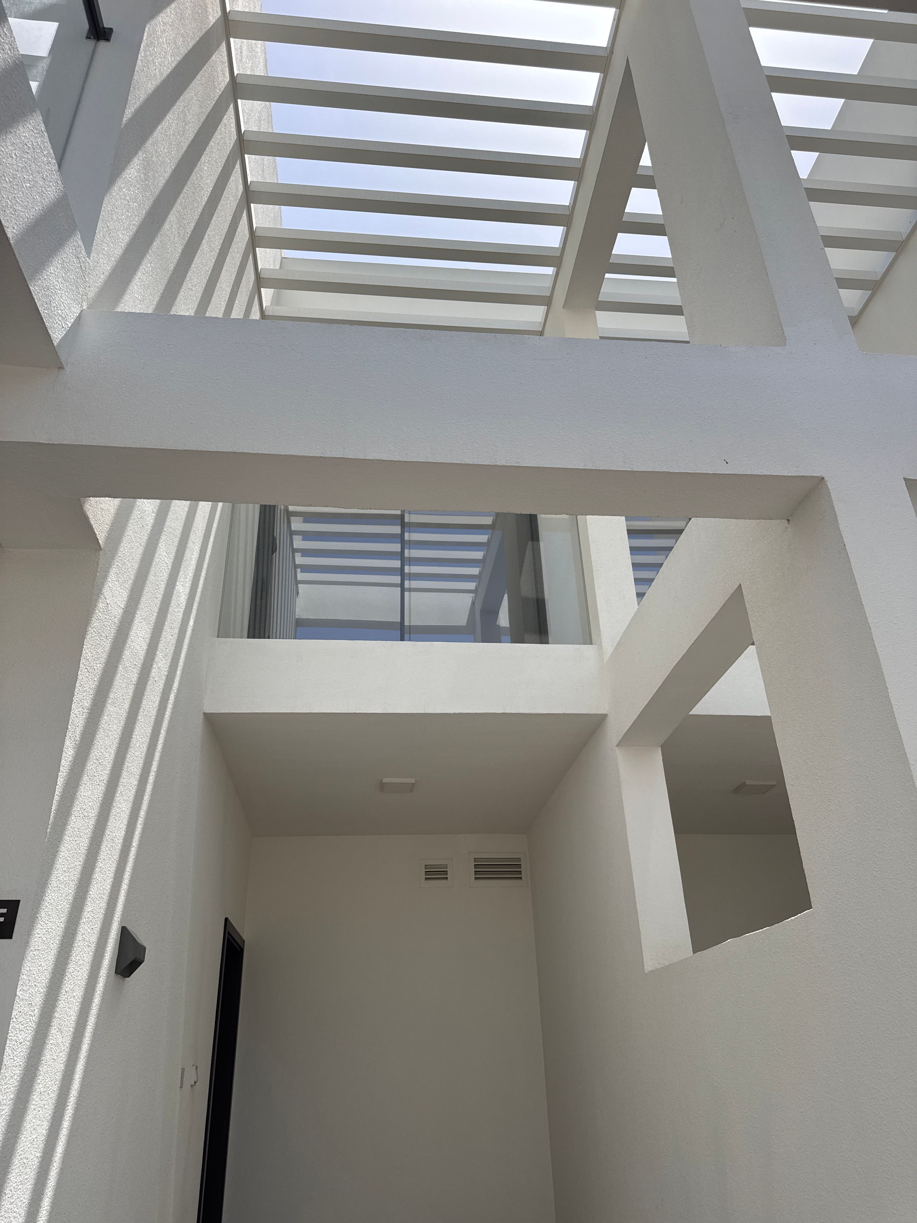 Modern Architectural Courtyard with Open Skylight · Free Stock Photo