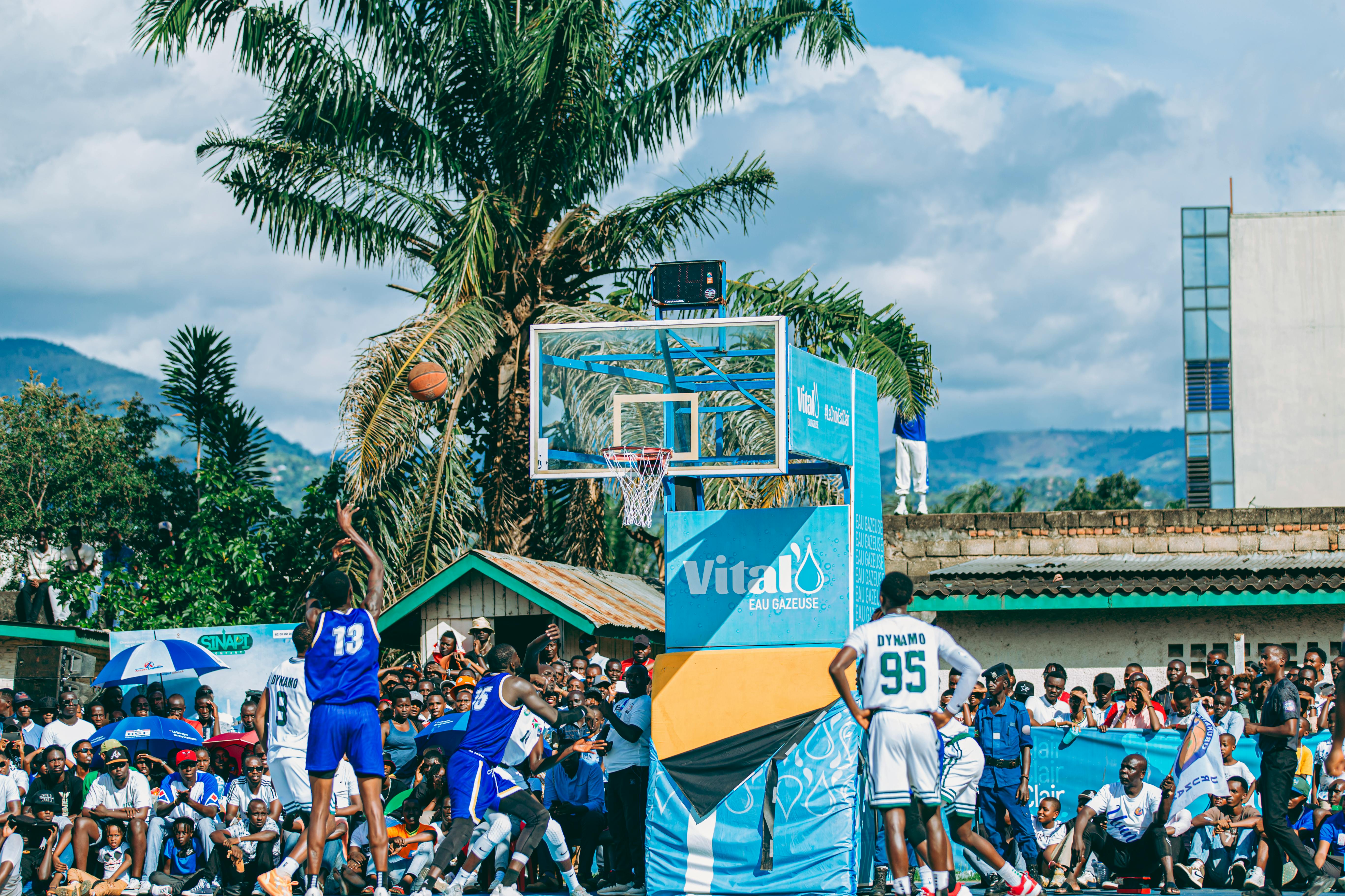 Outdoor Basketball Game with Enthusiastic Crowd · Free Stock Photo