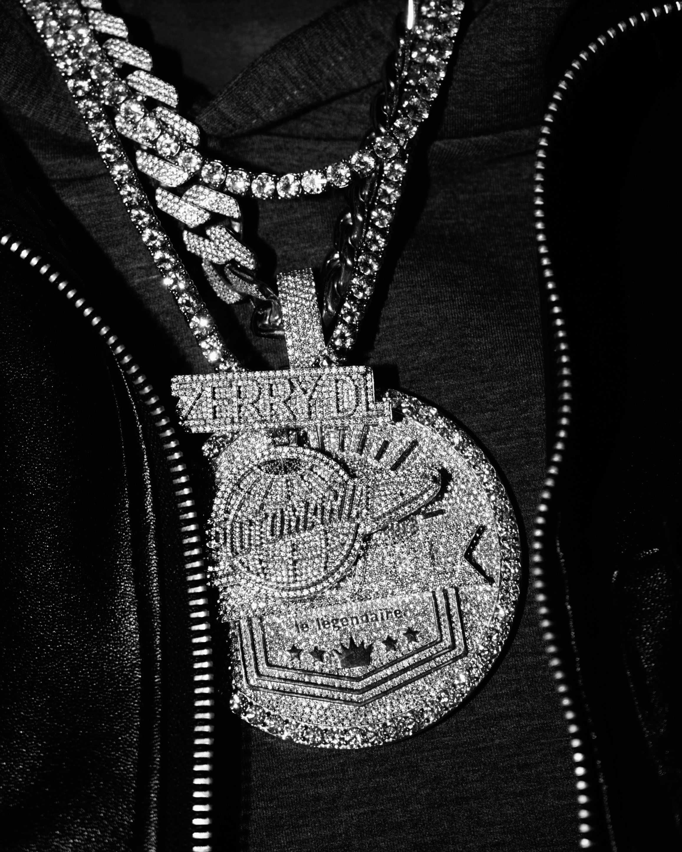 Close-up of Diamond-Studded Pendant and Chain · Free Stock Photo