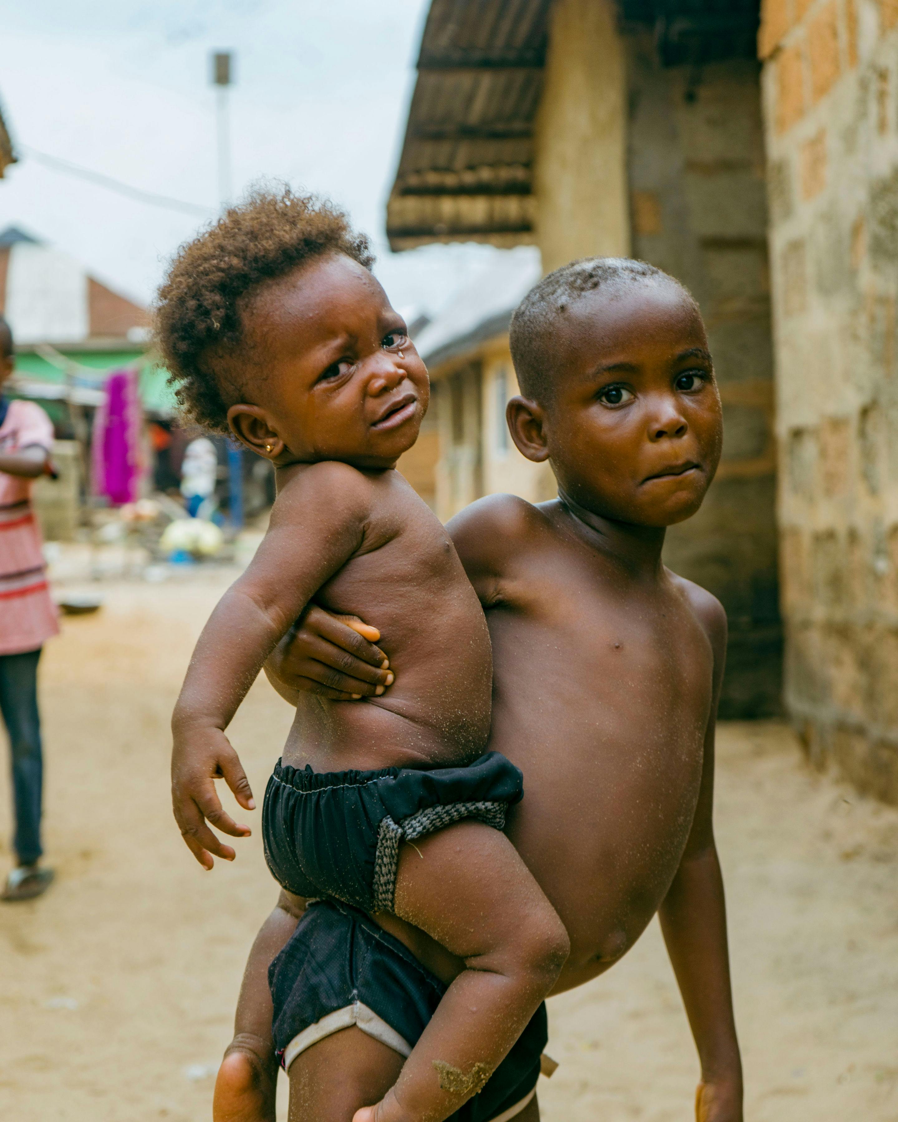 Children Playing Outdoors in African Village · Free Stock Photo
