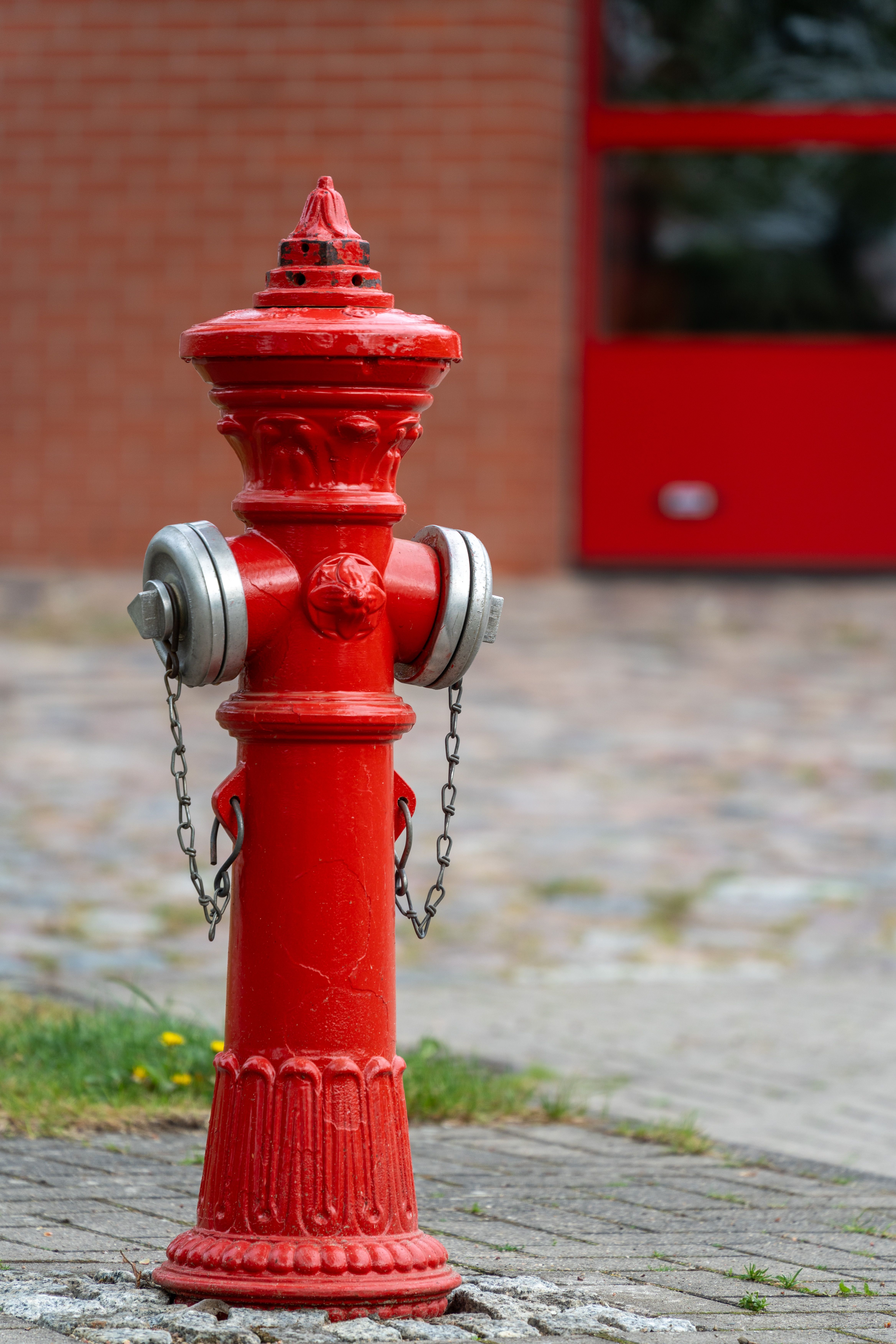 Red Fire Hydrant on Urban Street Corner · Free Stock Photo
