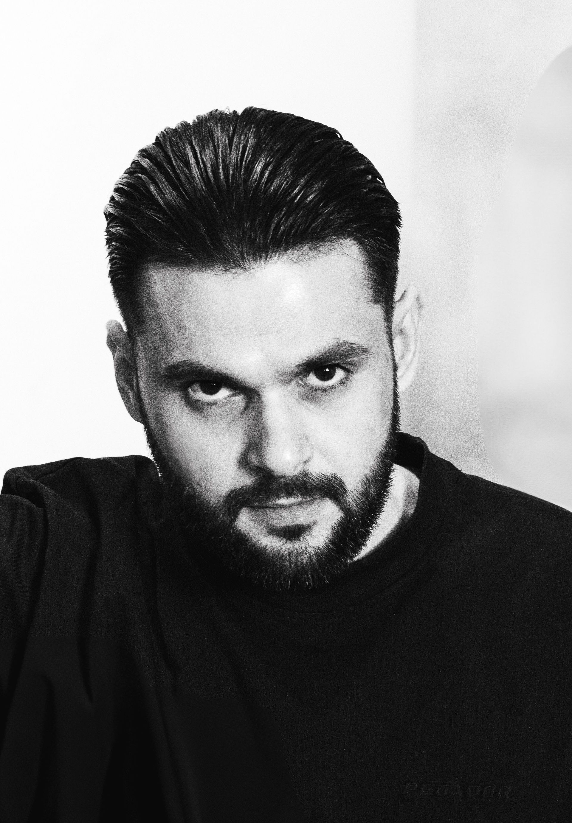 Black and White Portrait of a Man with Intense Stare · Free Stock Photo