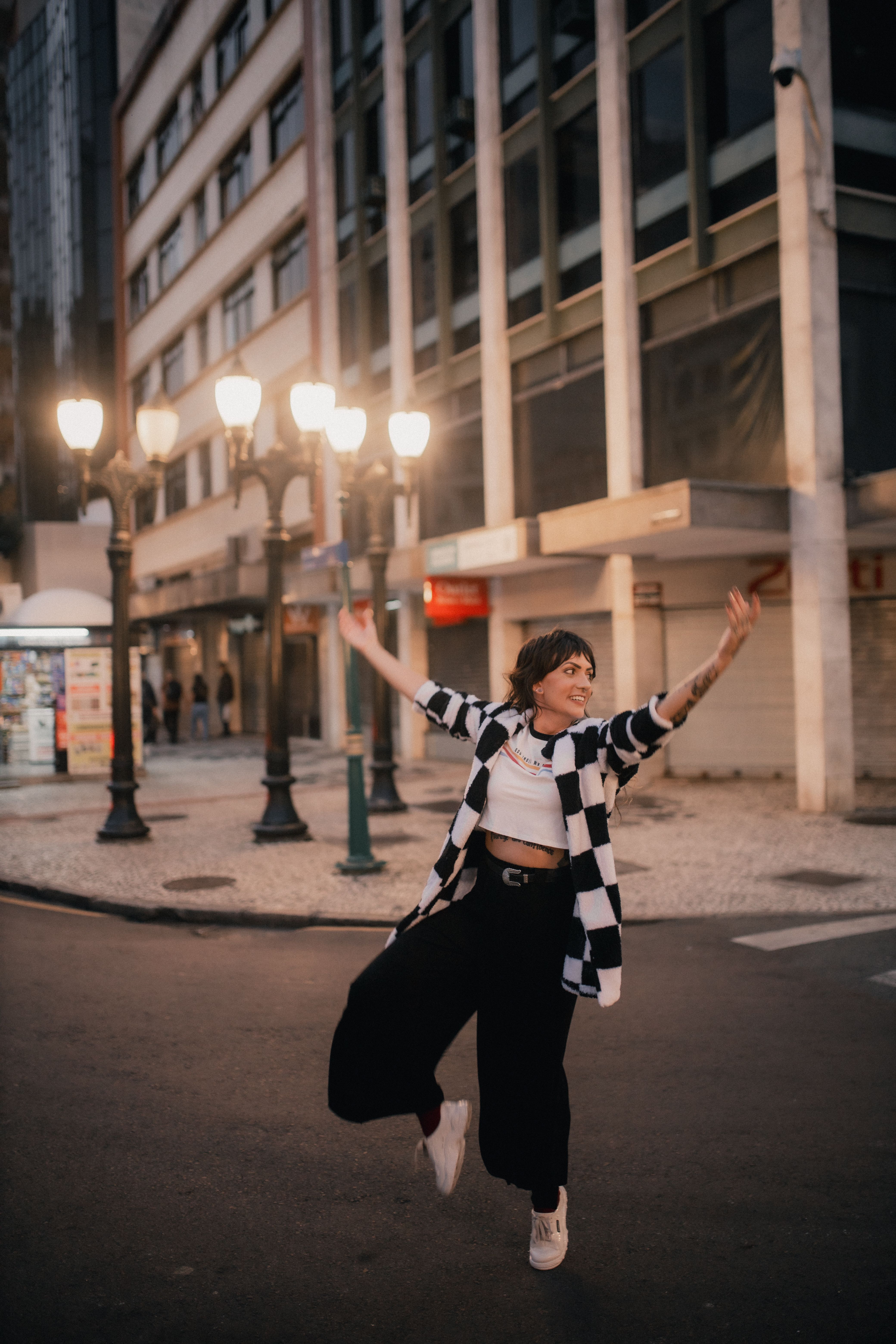 Joyful Woman Dancing in Urban Street at Night · Free Stock Photo