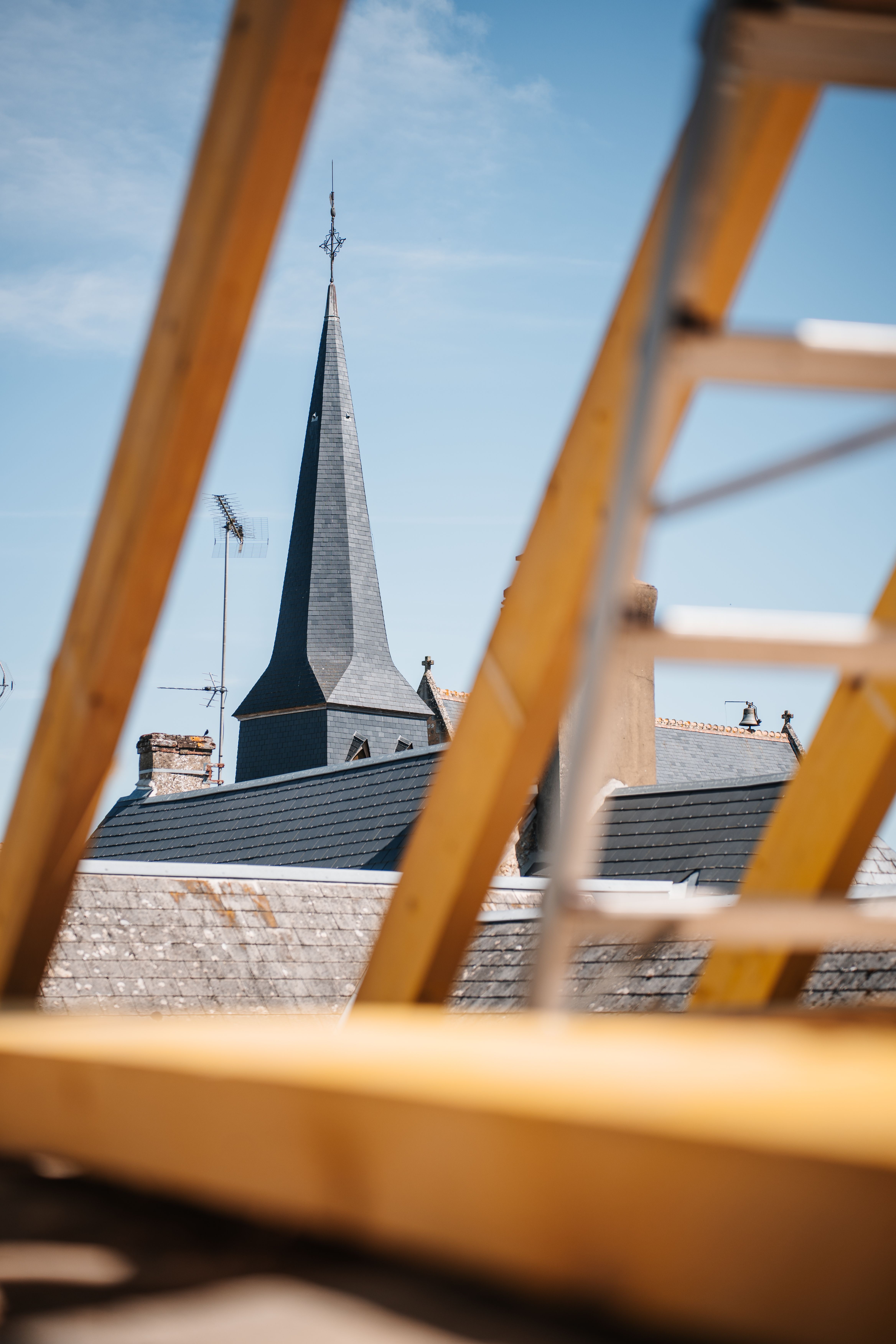 Construction Site with Church Spire in Background · Free Stock Photo