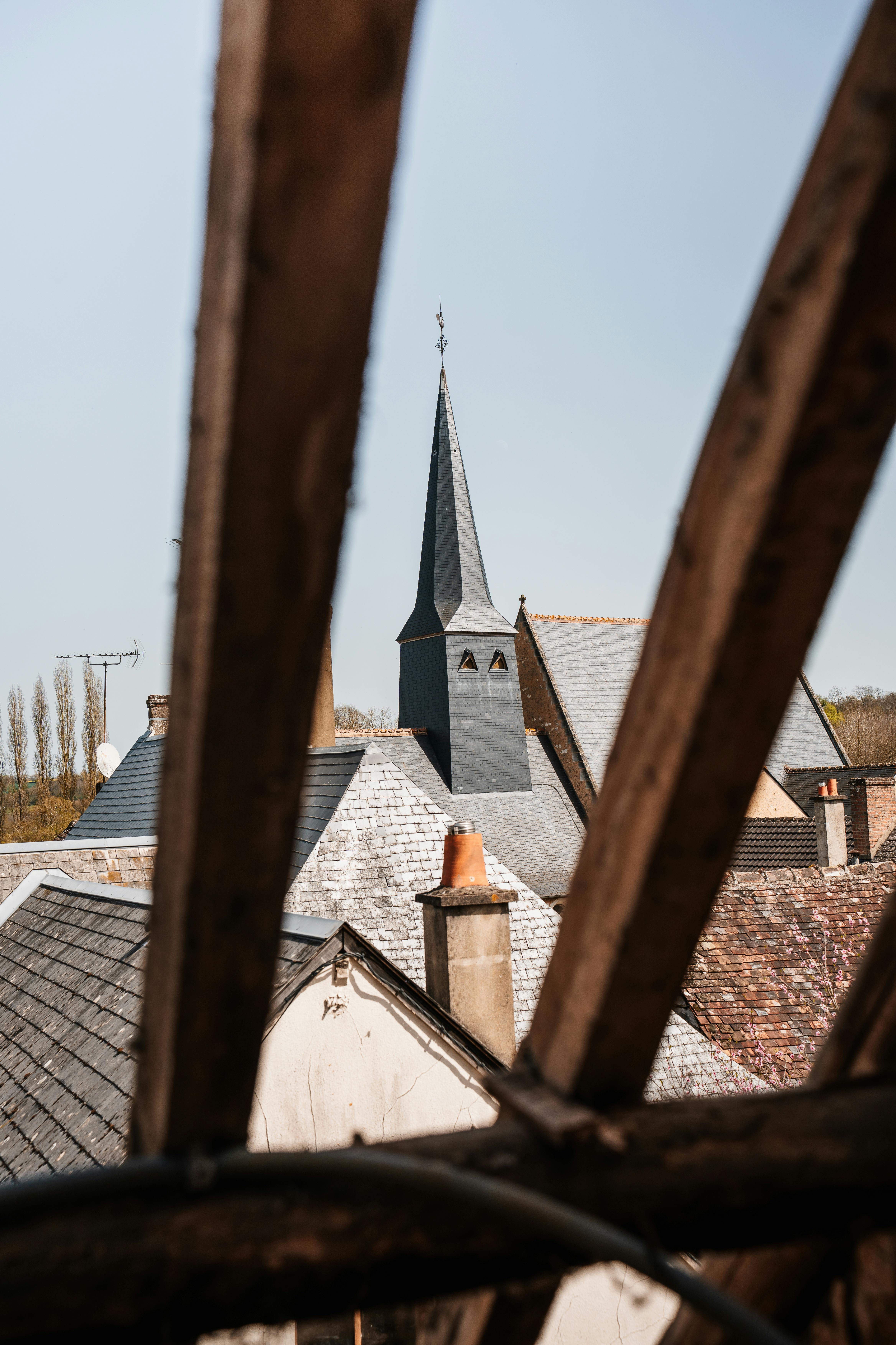 Rustic Village Rooftops with Church Spire · Free Stock Photo