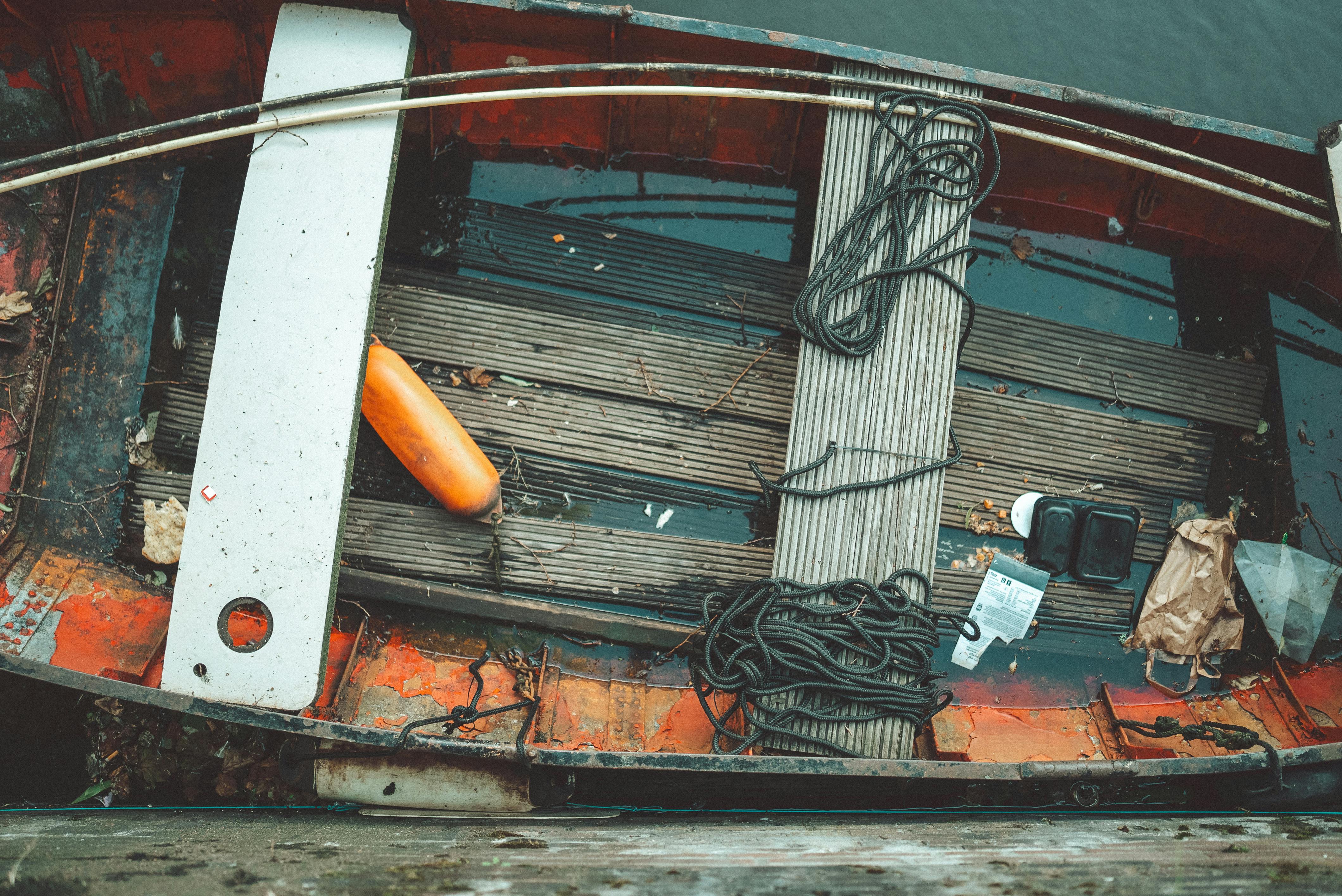 Aerial View of Weathered Rowboat with Nautical Equipment · Free Stock Photo