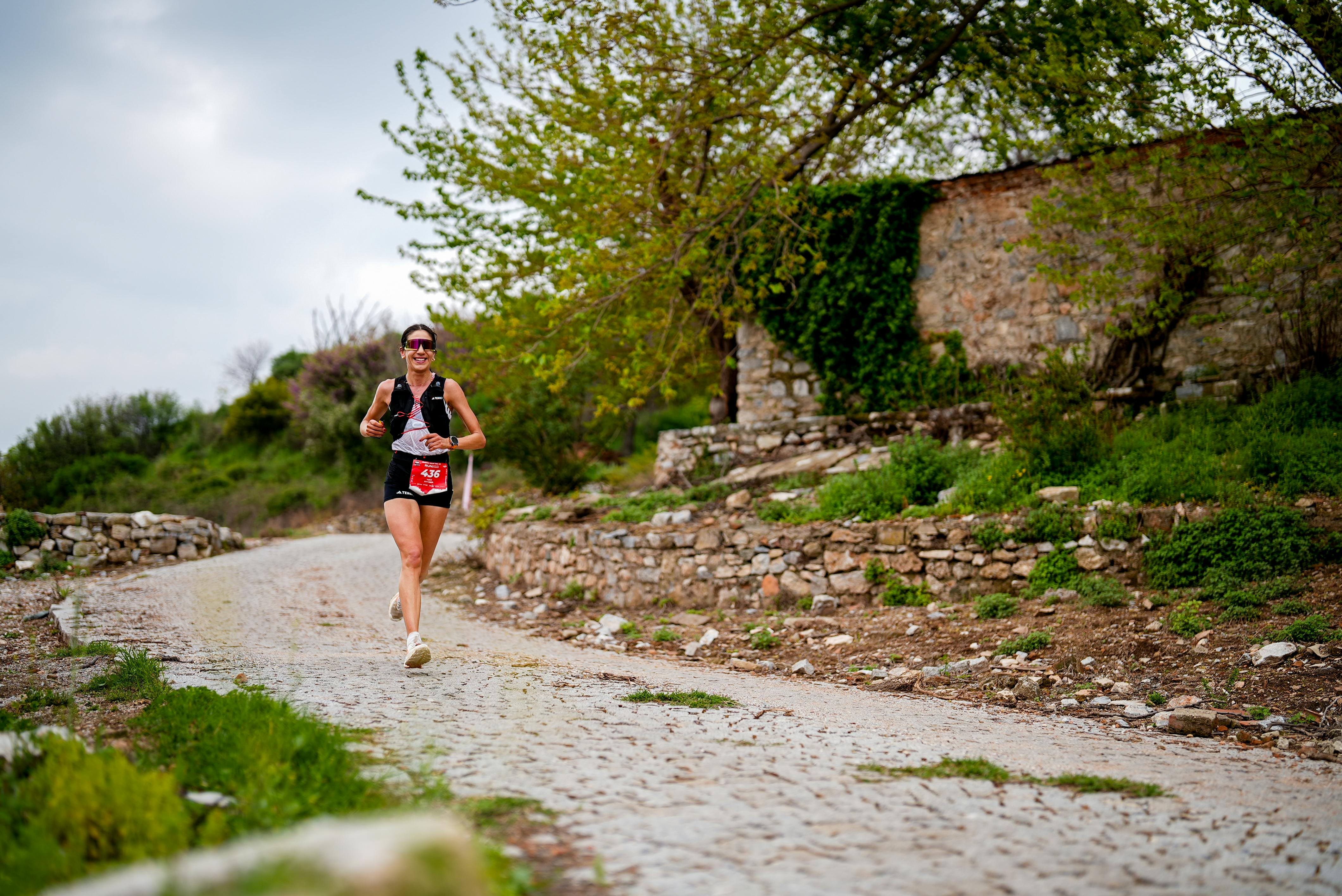 Athlete Running on Cobblestone Path in İzmir · Free Stock Photo