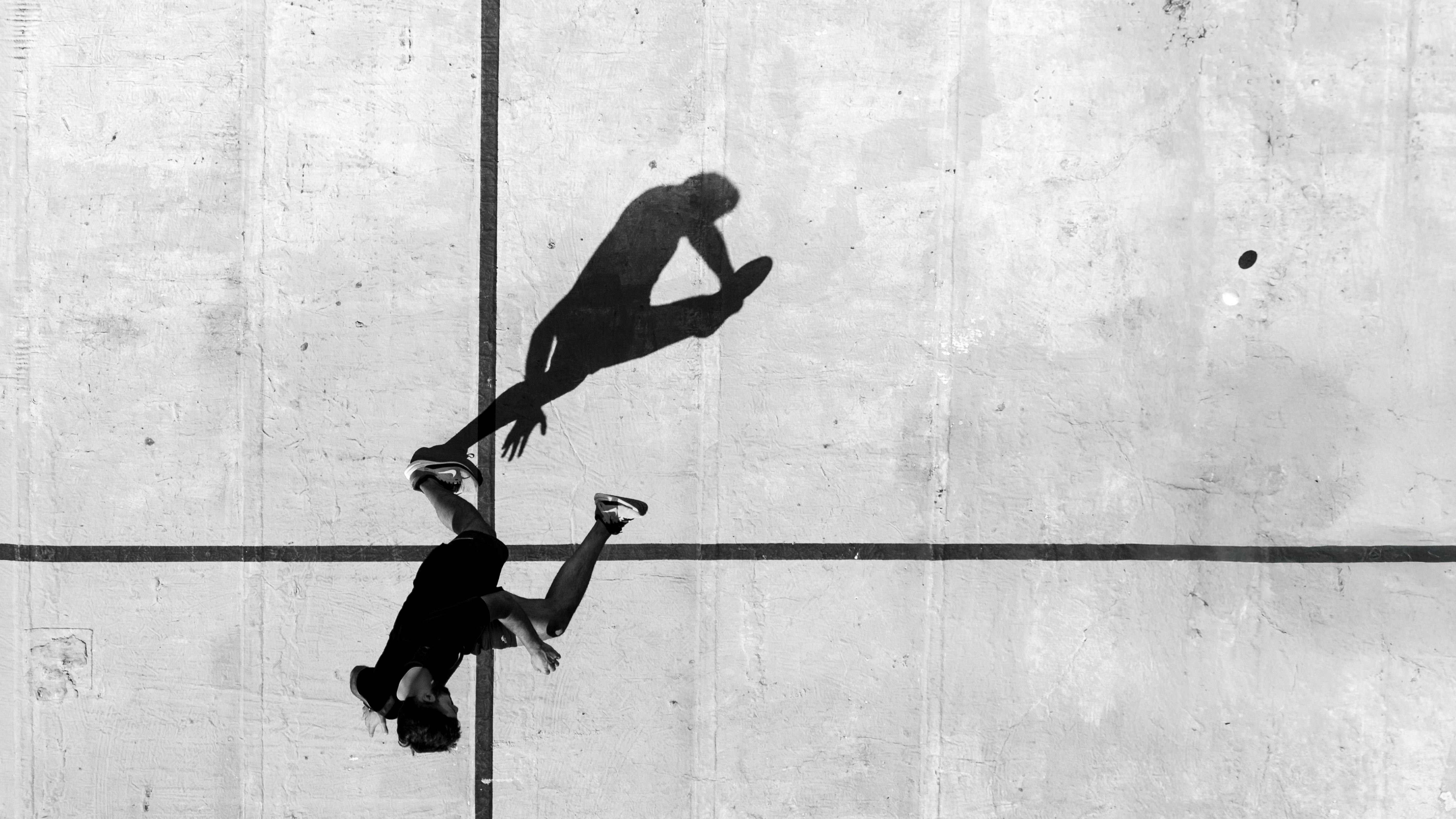 Aerial View of Athletic Shadow on Concrete · Free Stock Photo