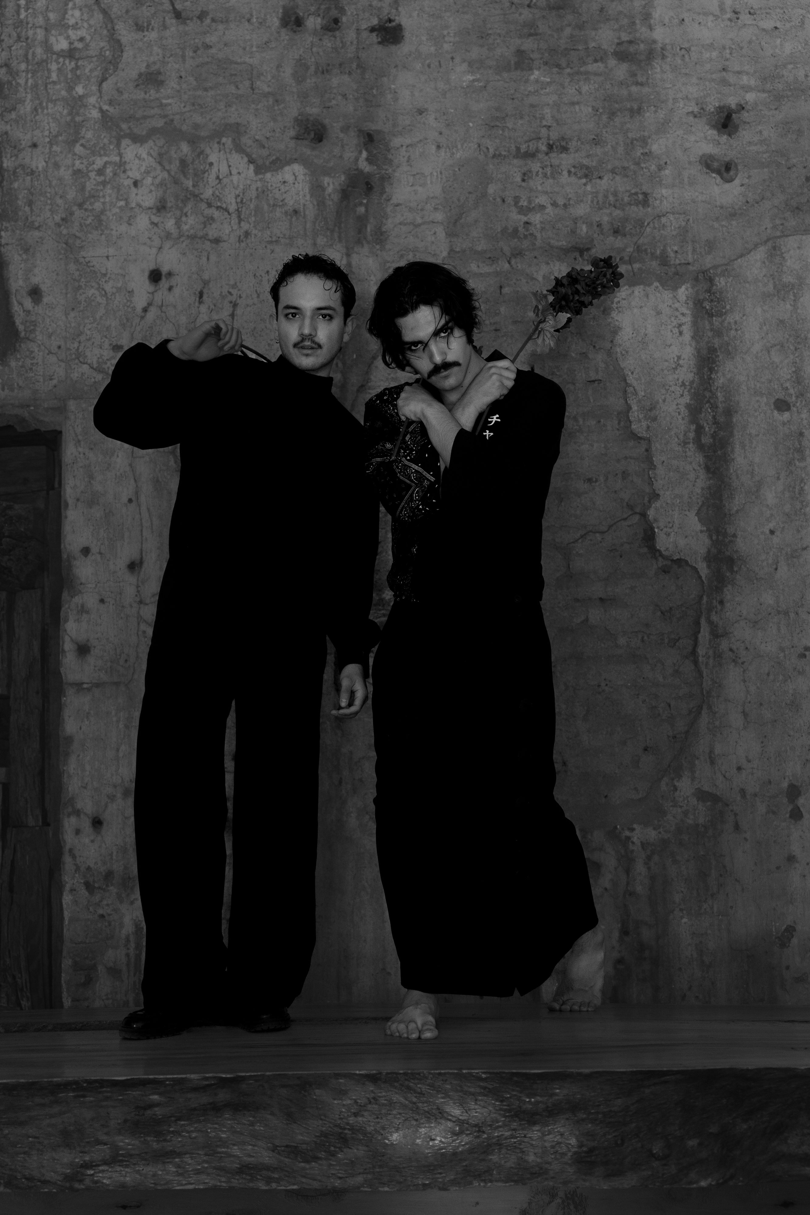 Artistic Portrait of Two Men in Black Attire · Free Stock Photo