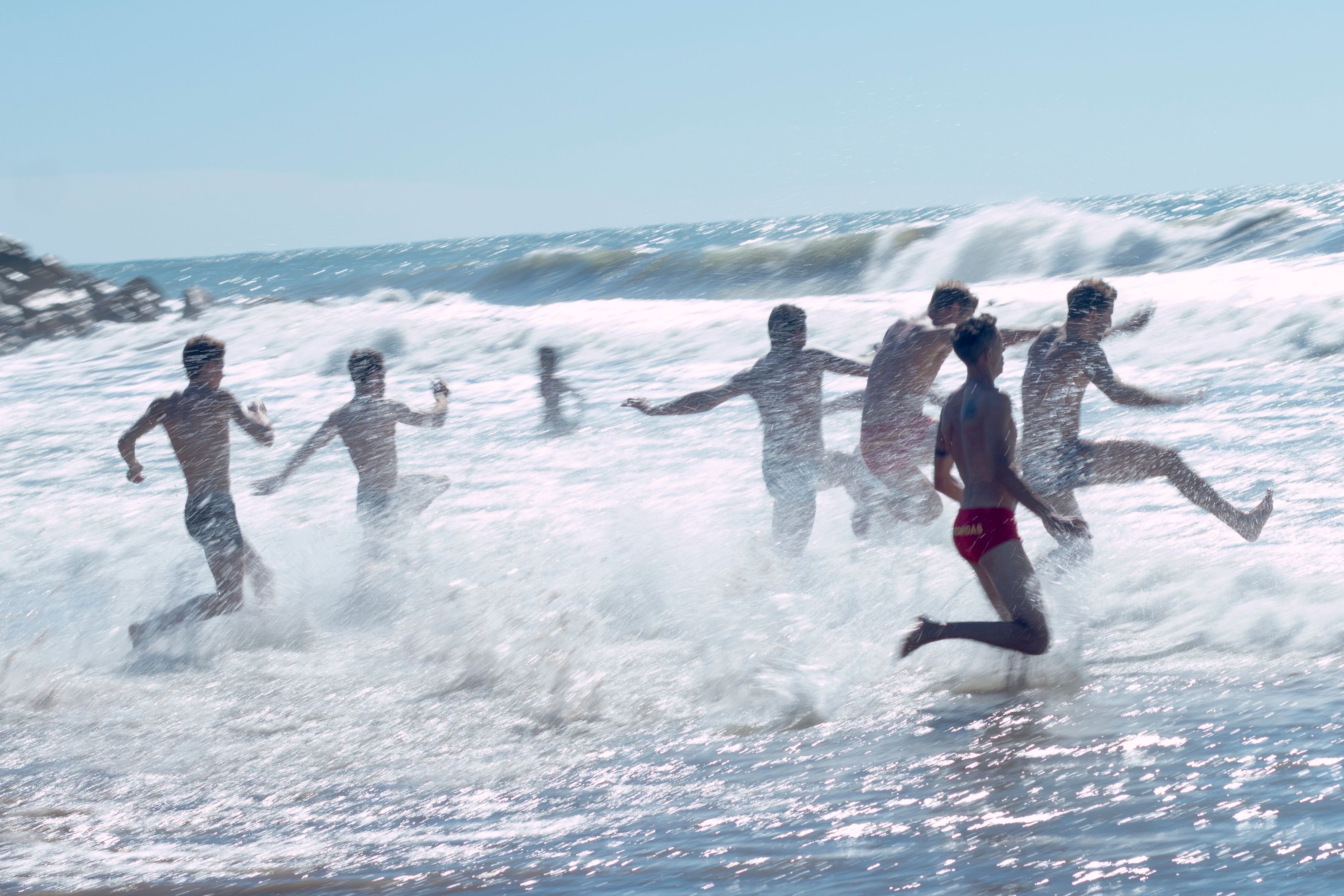 Young Men Enjoying Beach Waves in Mar del Plata · Free Stock Photo