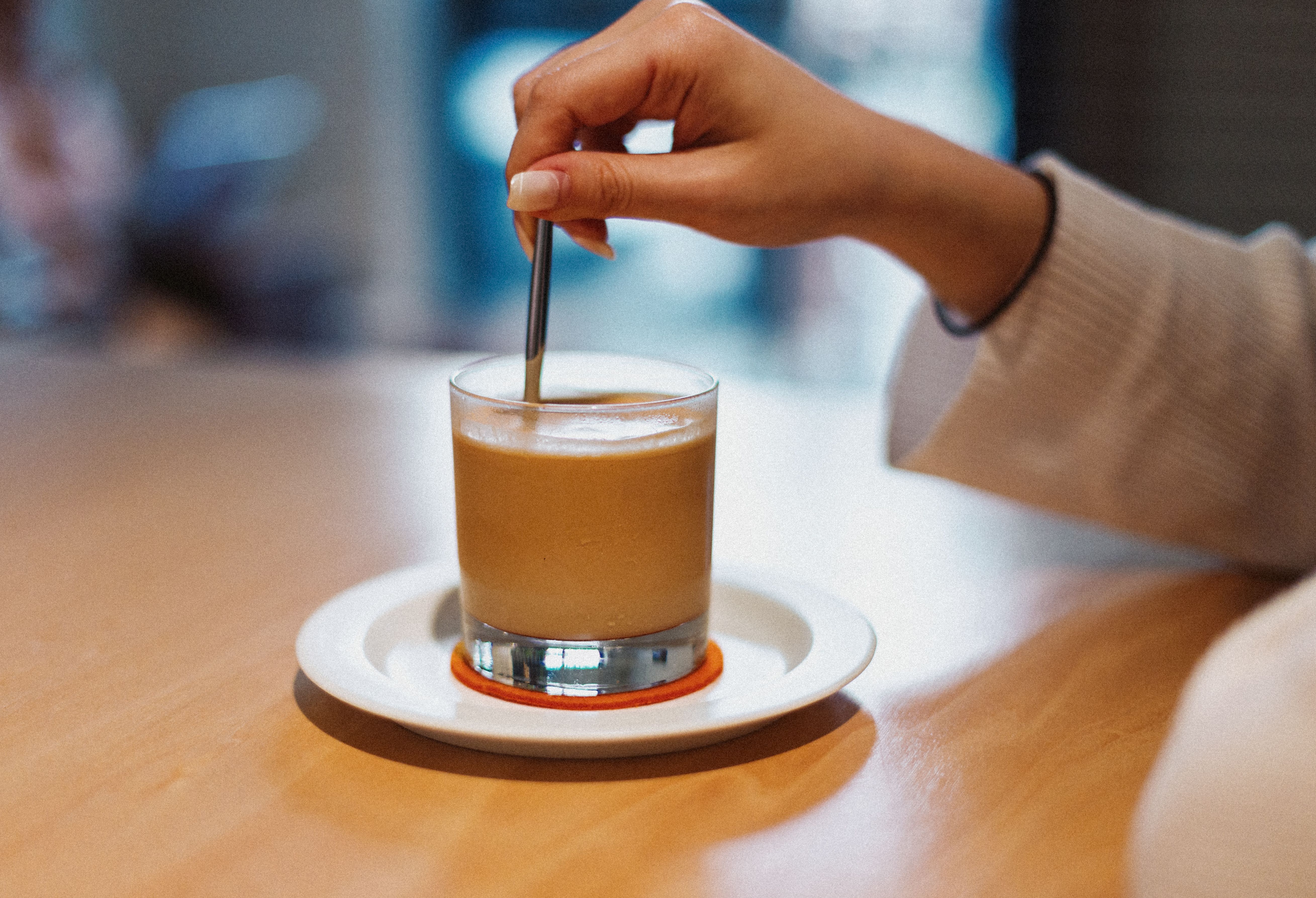 Close-up of Hand Stirring Coffee in Shinjuku Cafe · Free Stock Photo