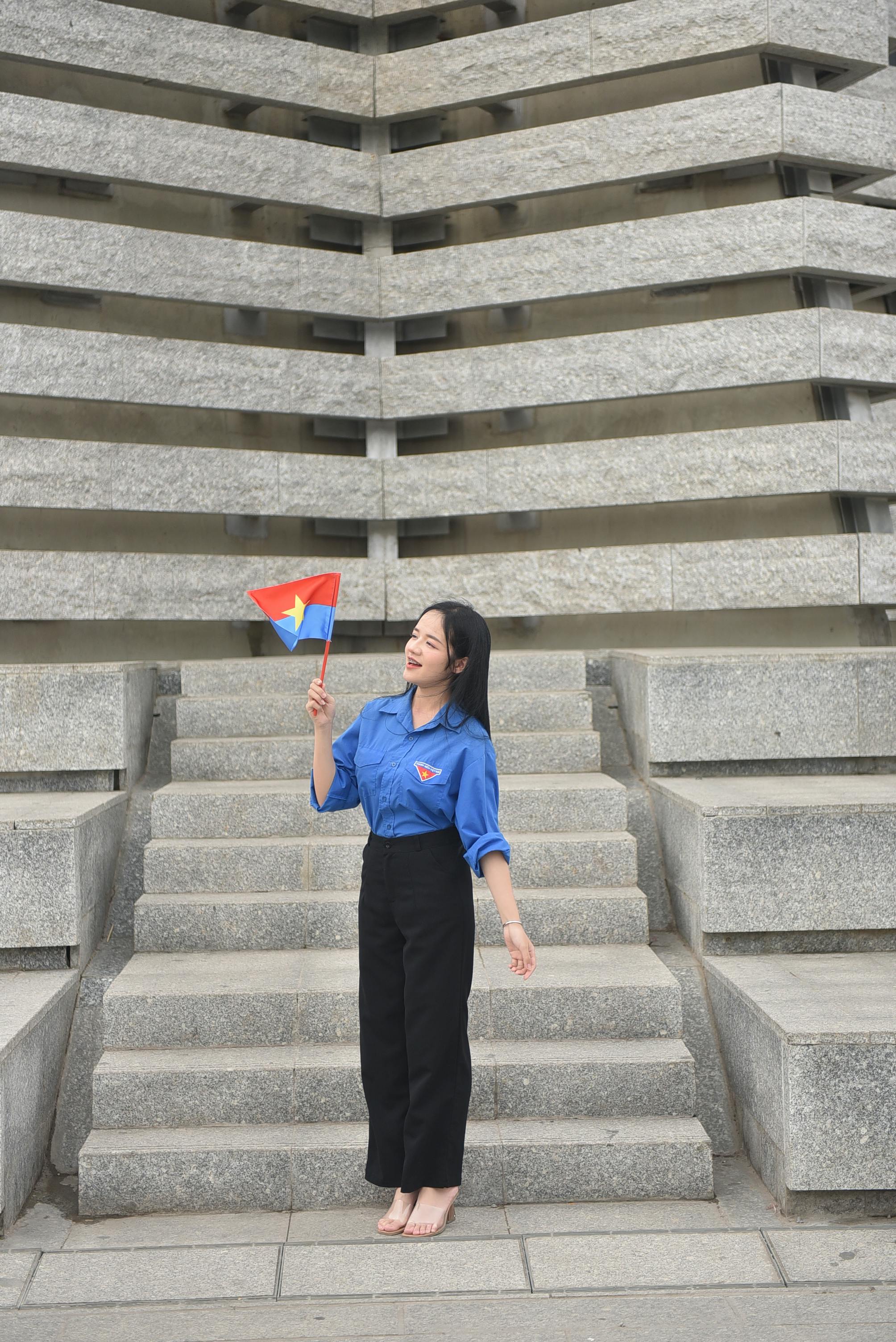 Woman Holding Flag on Urban Stone Stairs · Free Stock Photo
