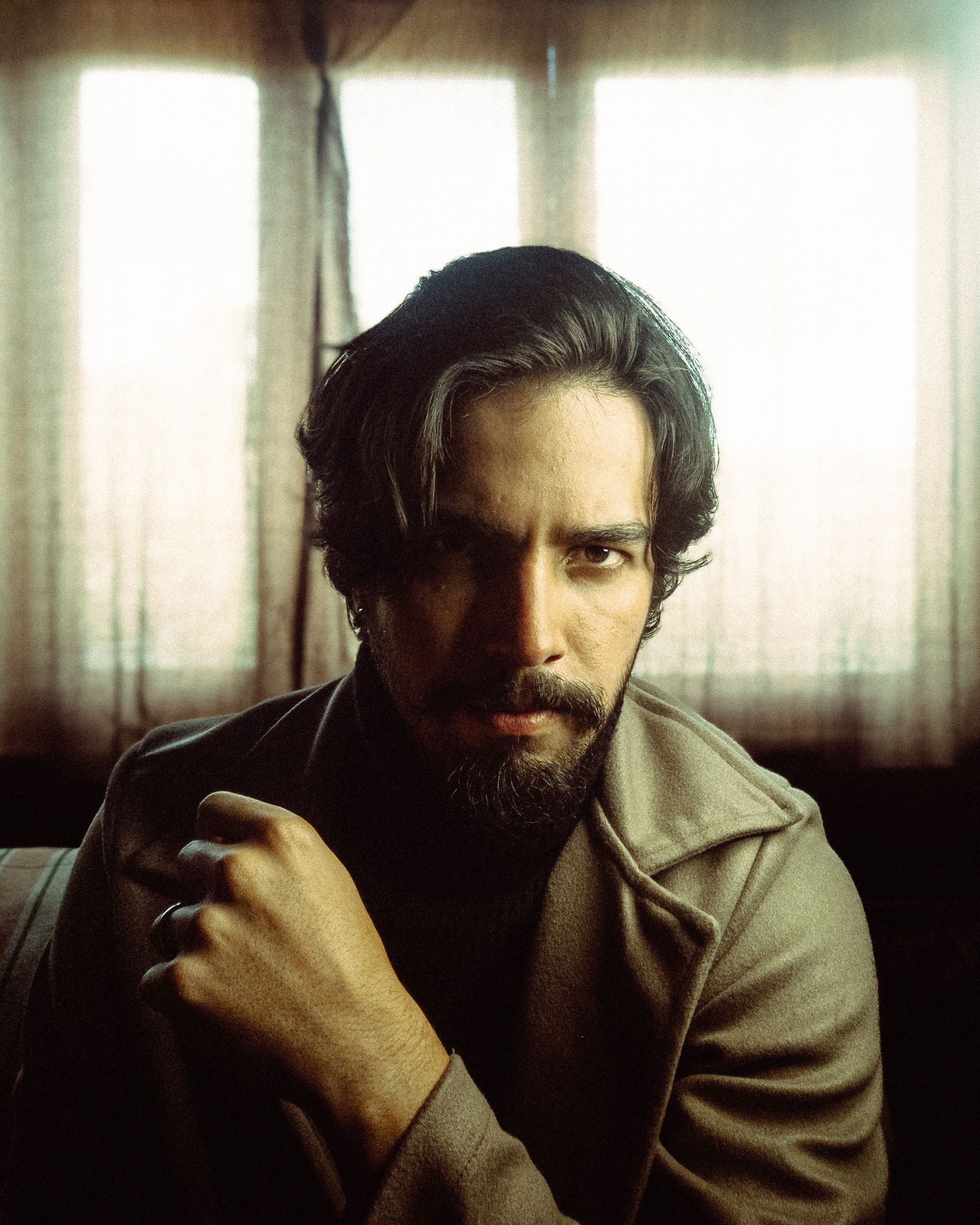 Moody Portrait of Man in Dimly Lit Room · Free Stock Photo