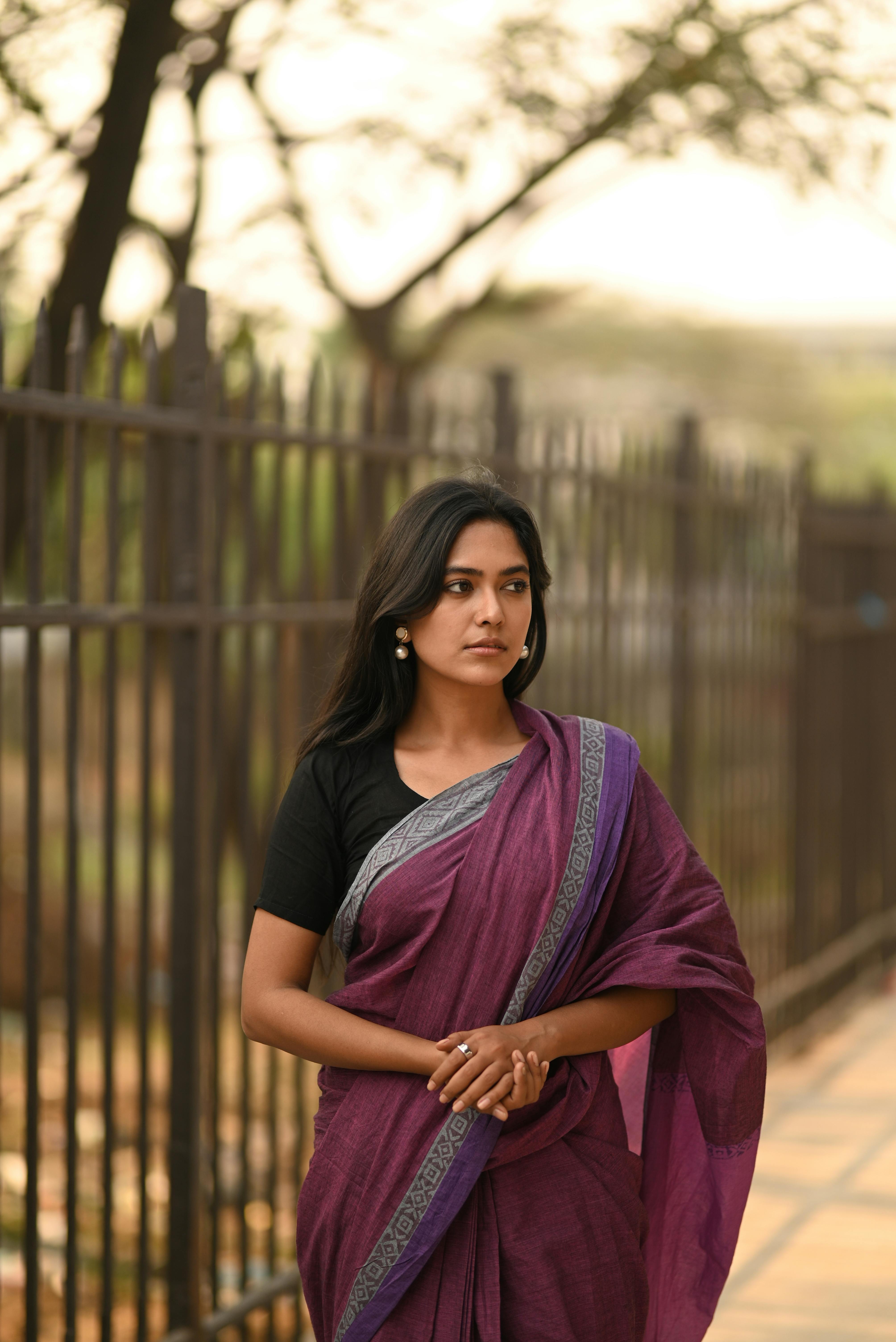Woman in Purple Saree Walking Outdoors · Free Stock Photo
