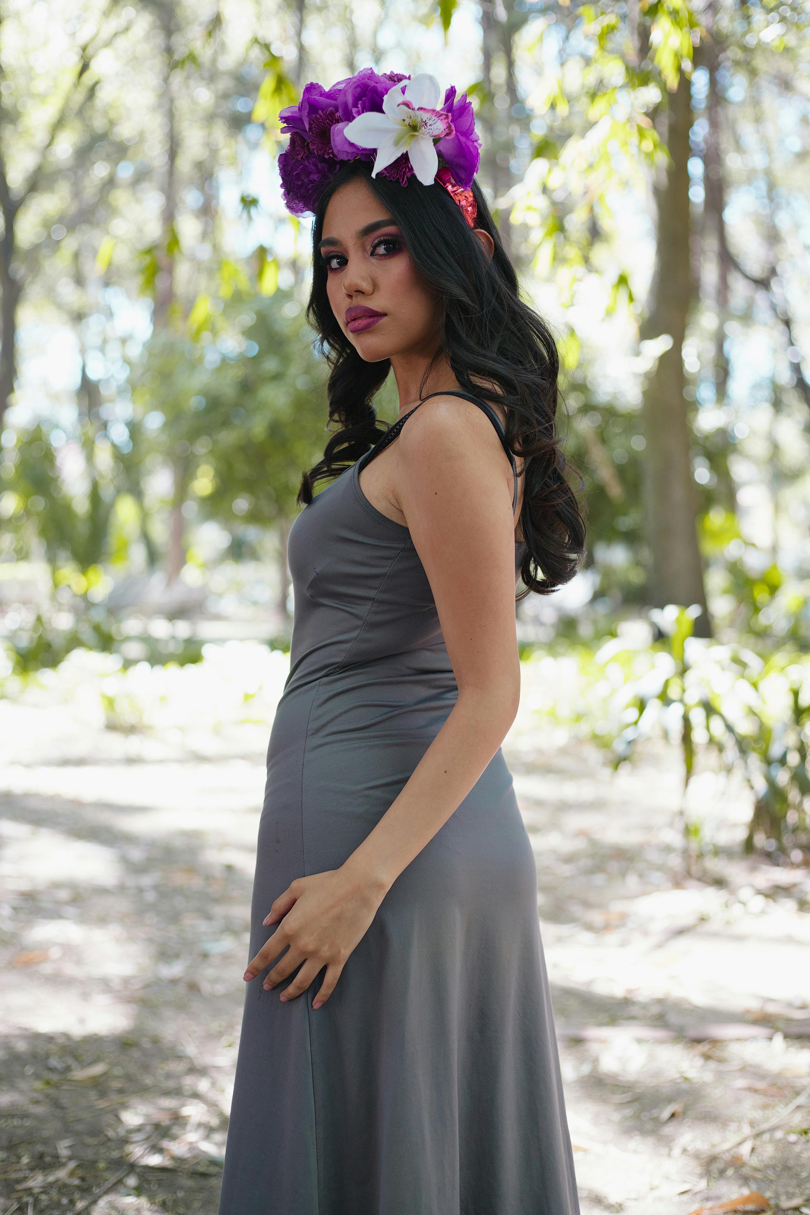 Elegant Woman with Floral Headdress in Forest Setting · Free Stock Photo