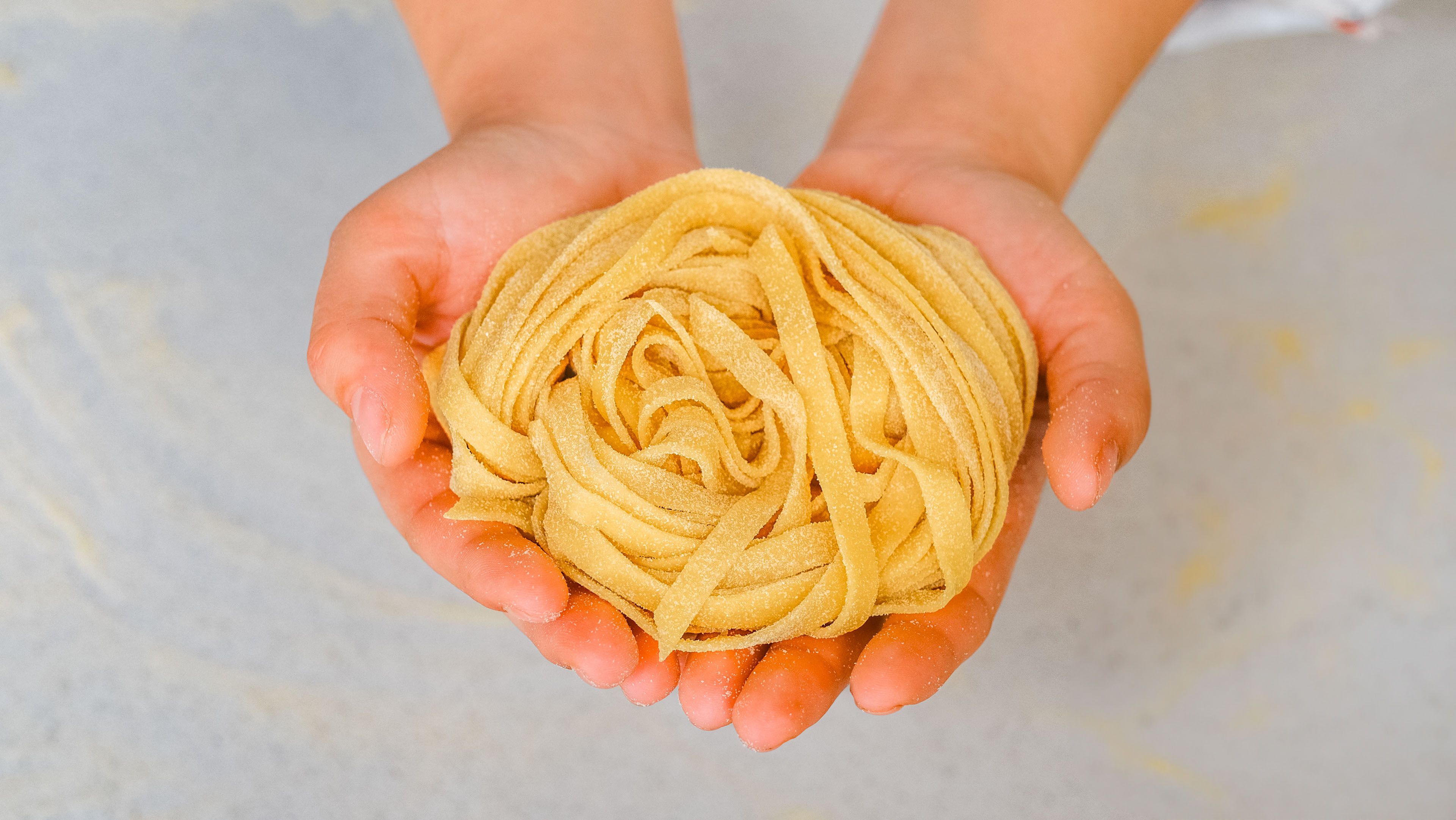 Freshly Made Pasta in Artisan Hands · Free Stock Photo